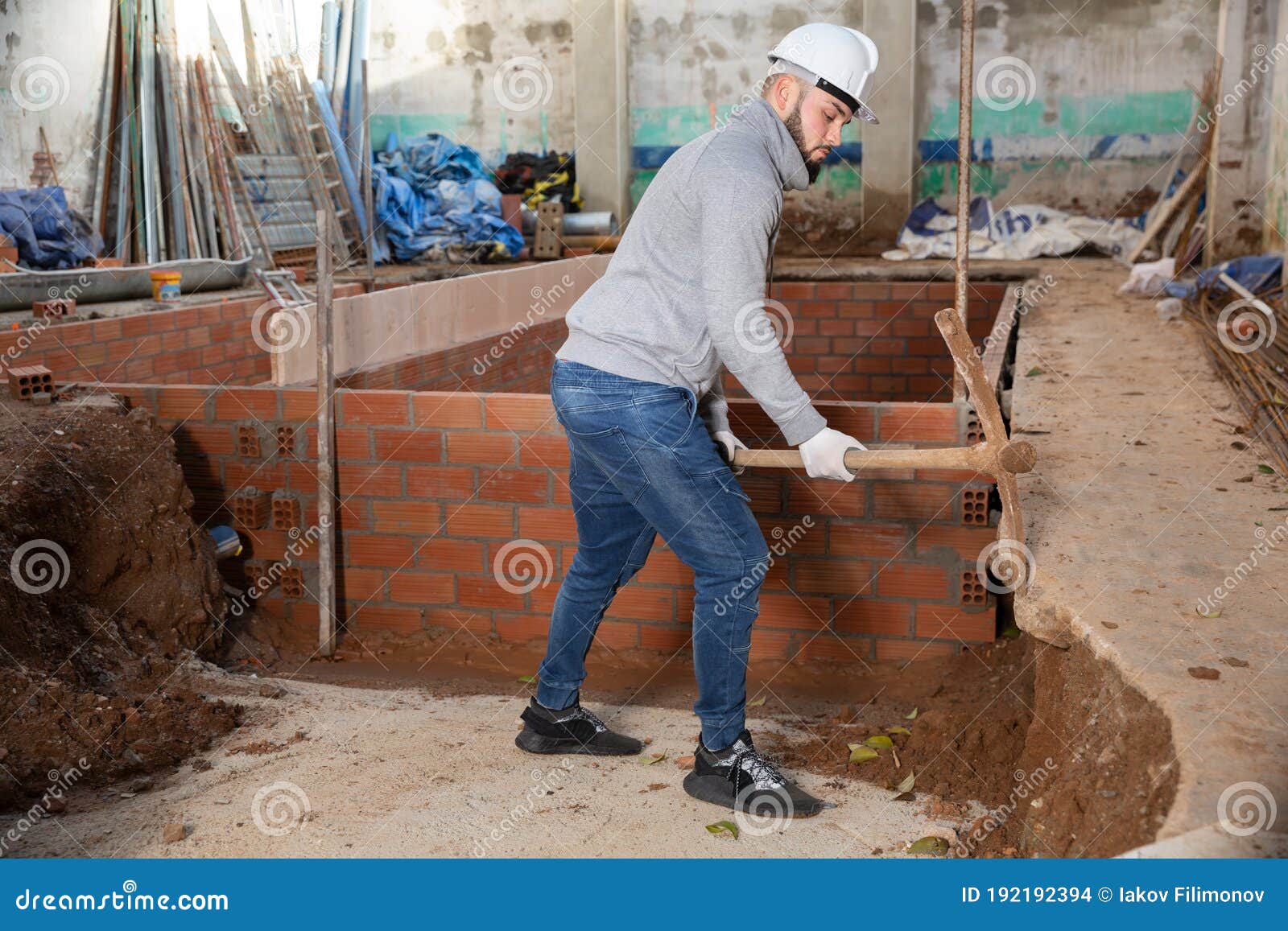Man Digging Ground with Pickaxe Stock Photo - Image of equipment ...