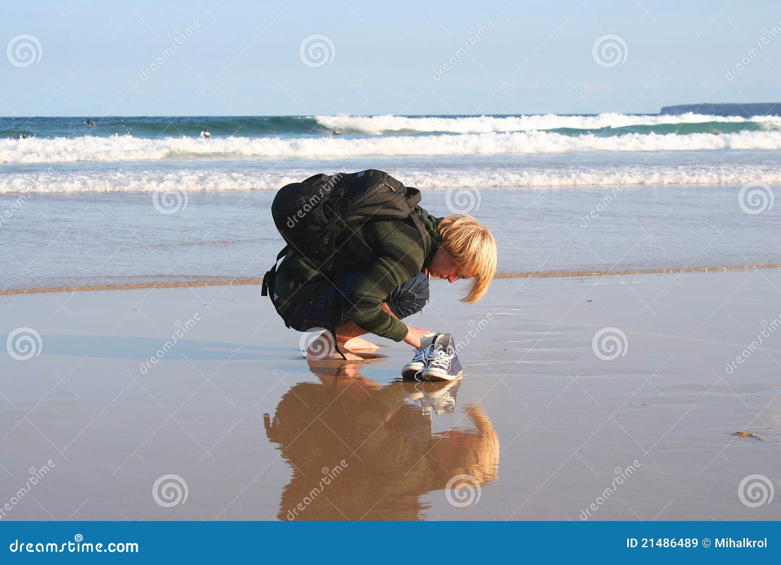 Young man digging in sand stock image. Image of caucasian - 21486489