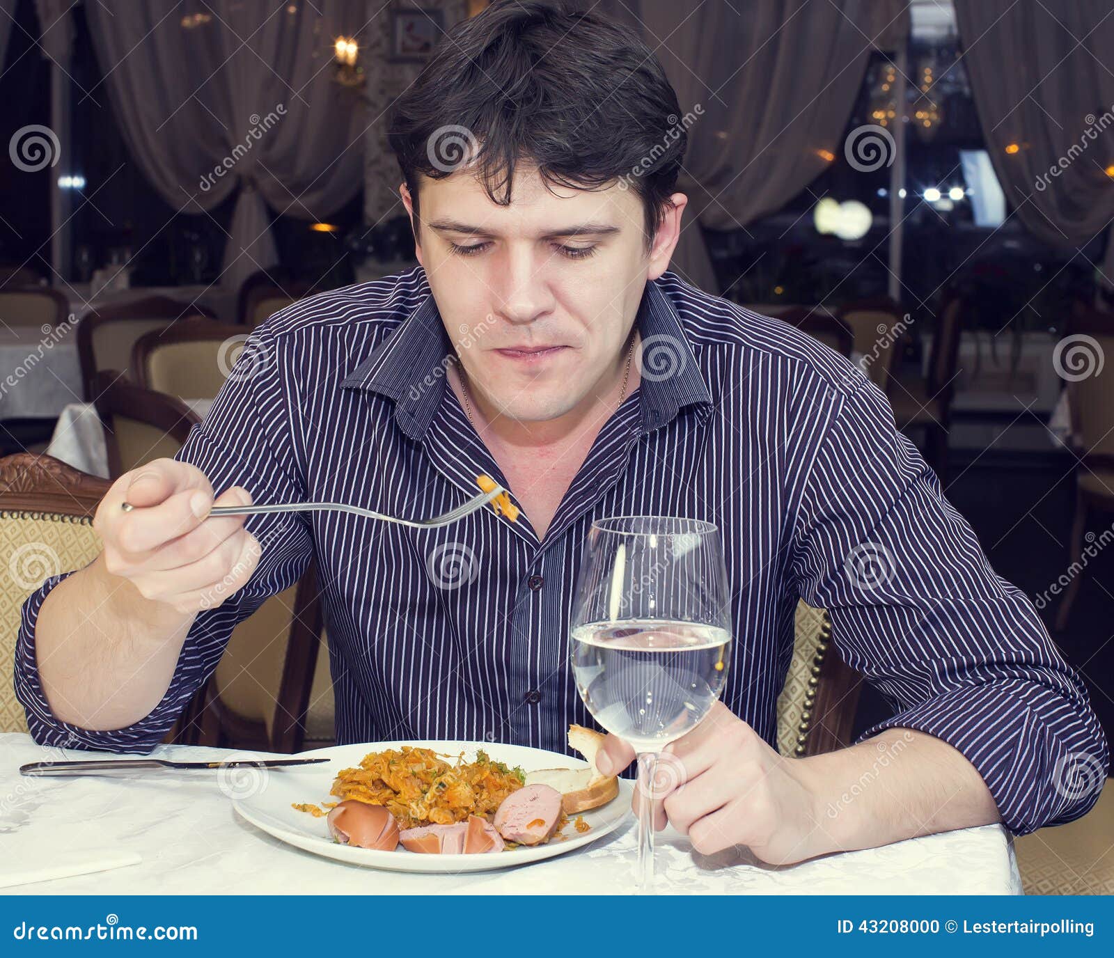 Young man dines stock photo. Image of beautiful, occasion - 43208000