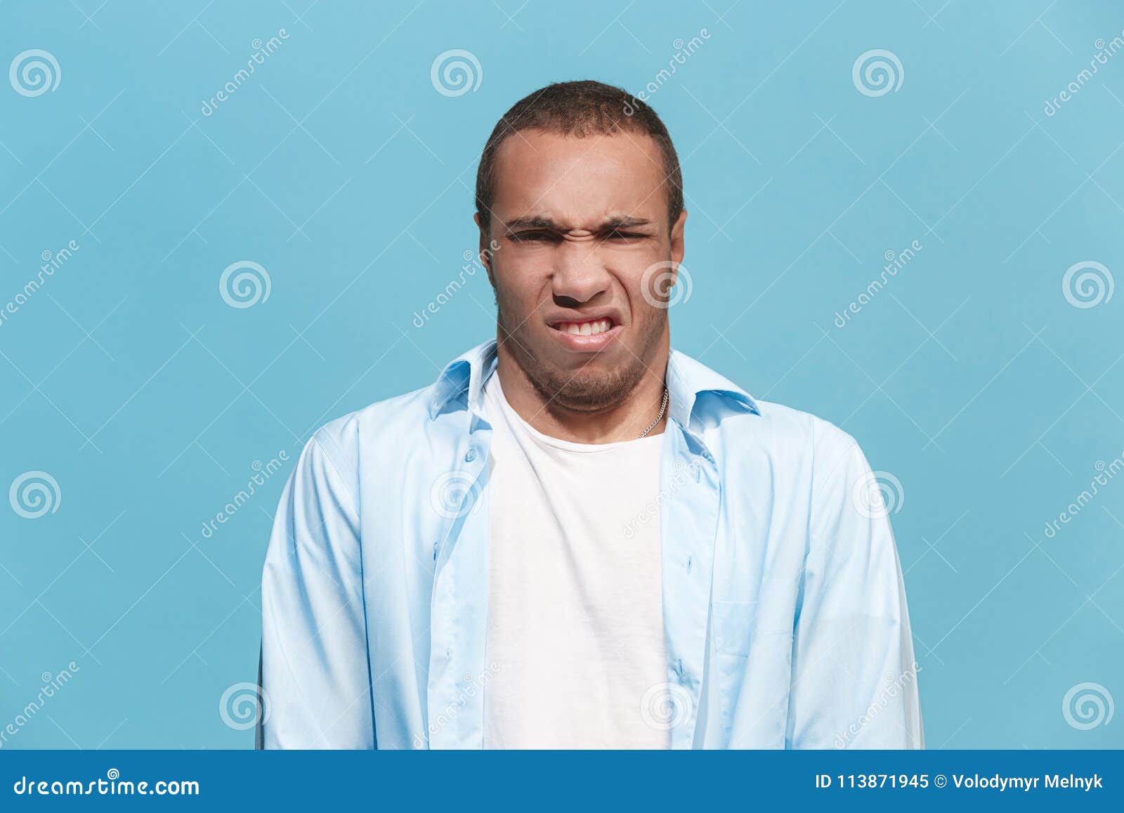 Young Man with Disgusted Expression Repulsing Something, Isolated on ...