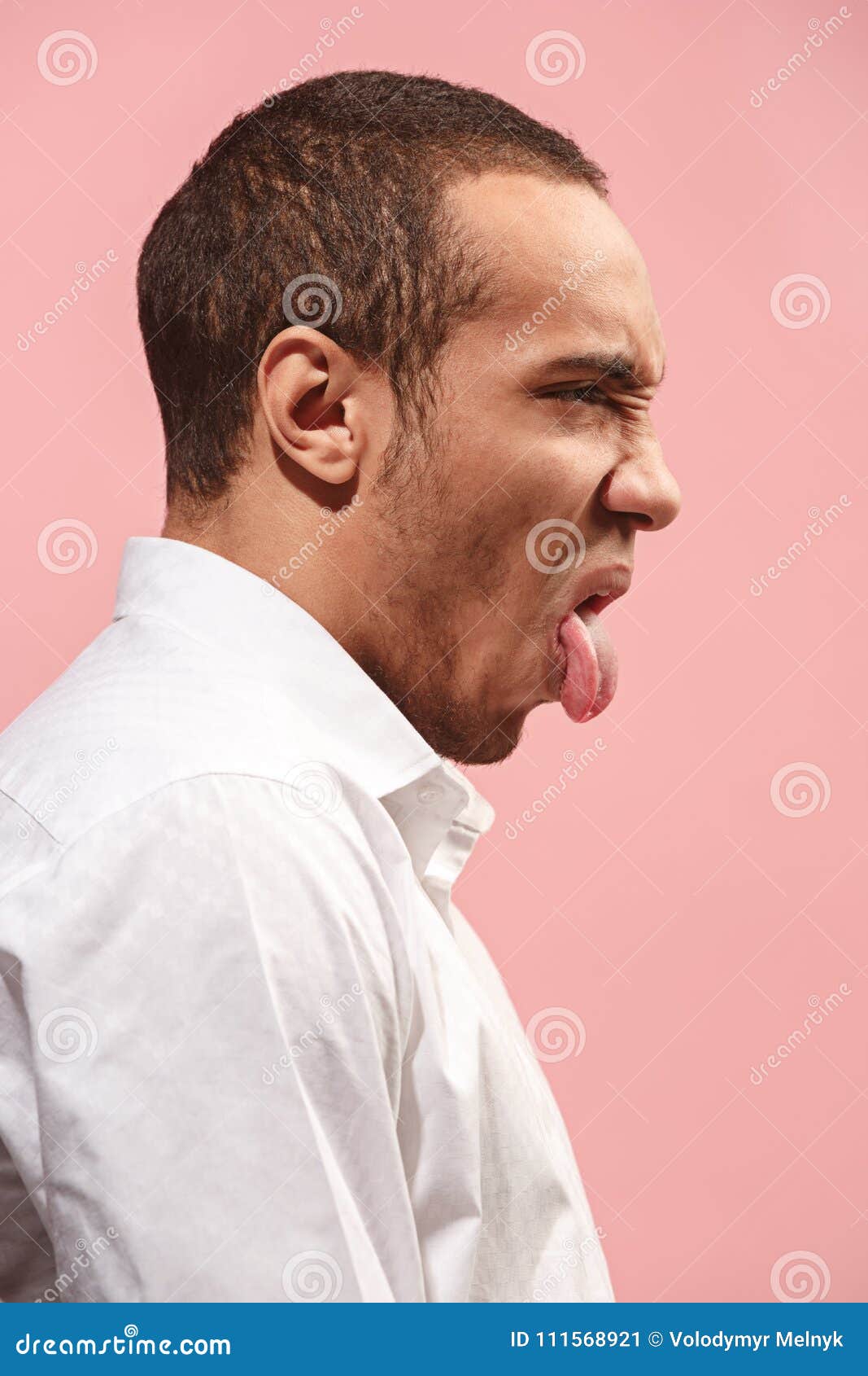 Young Man with Disgusted Expression Repulsing Something, on the Pink ...