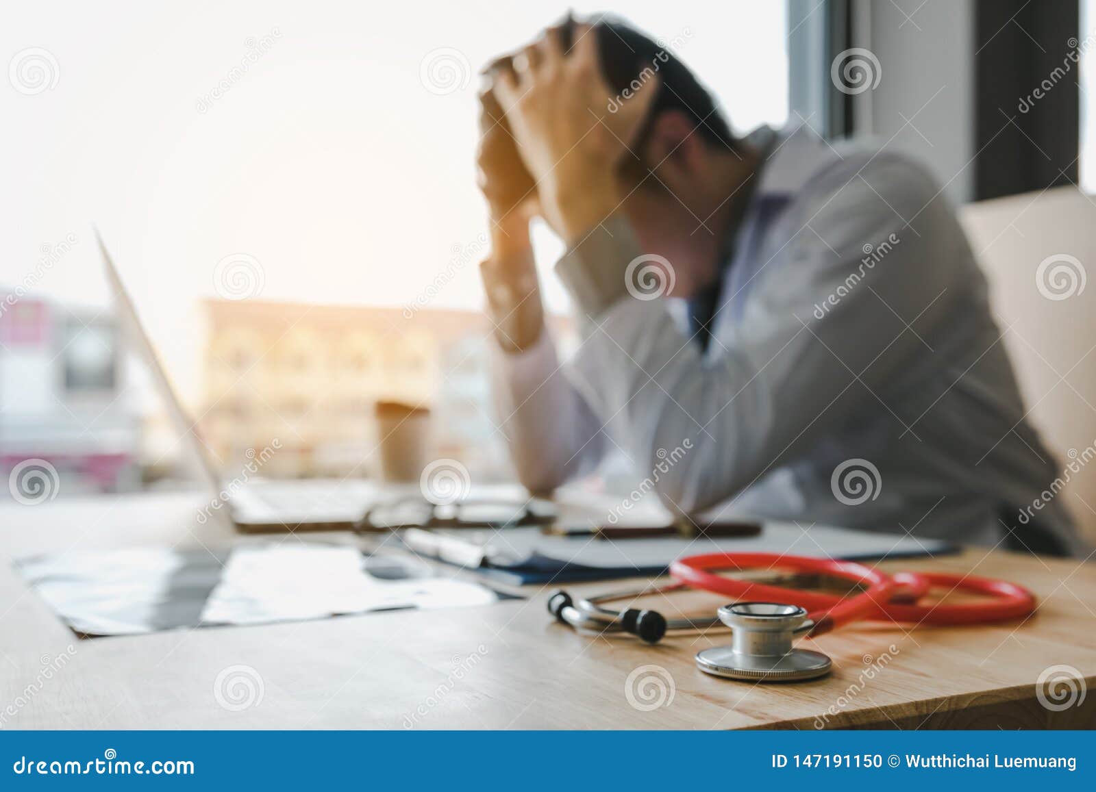 Exhausted Office Worker Sitting By The Desk With Flying Papers Around ...