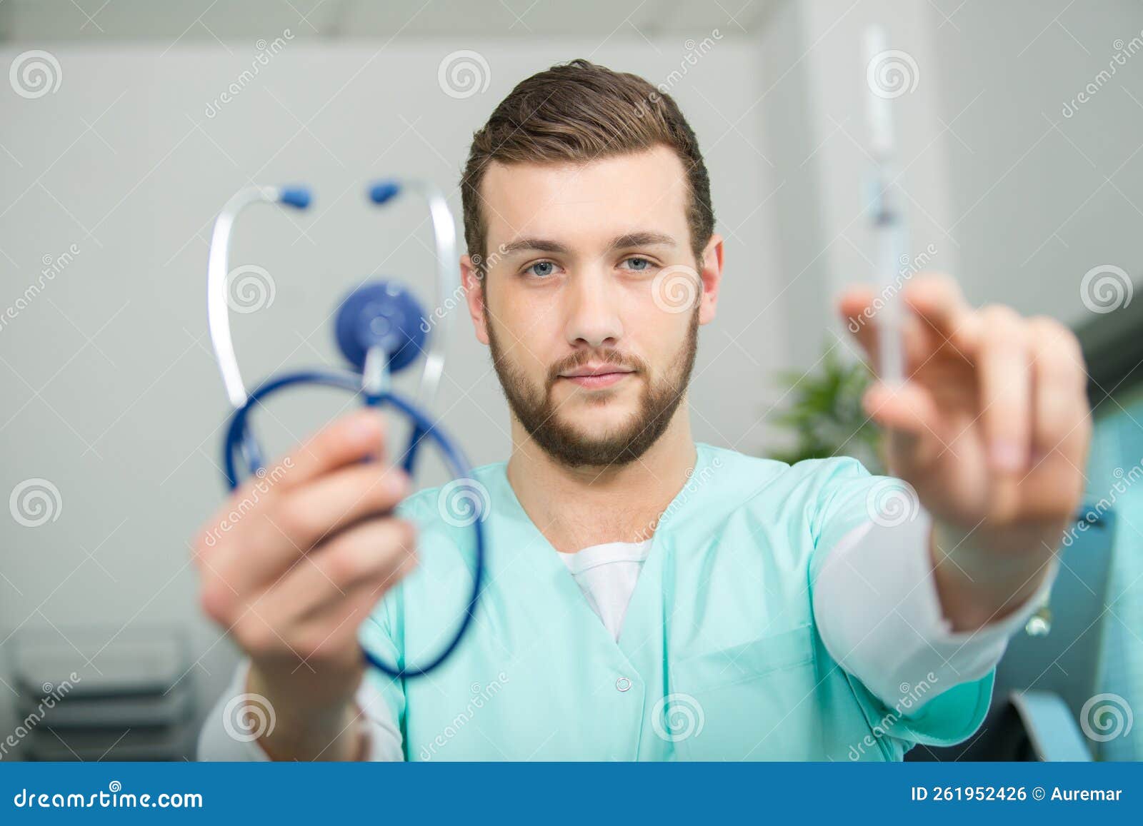 Young Man Doctor with Stethoscope Preparing Injection Stock Photo ...