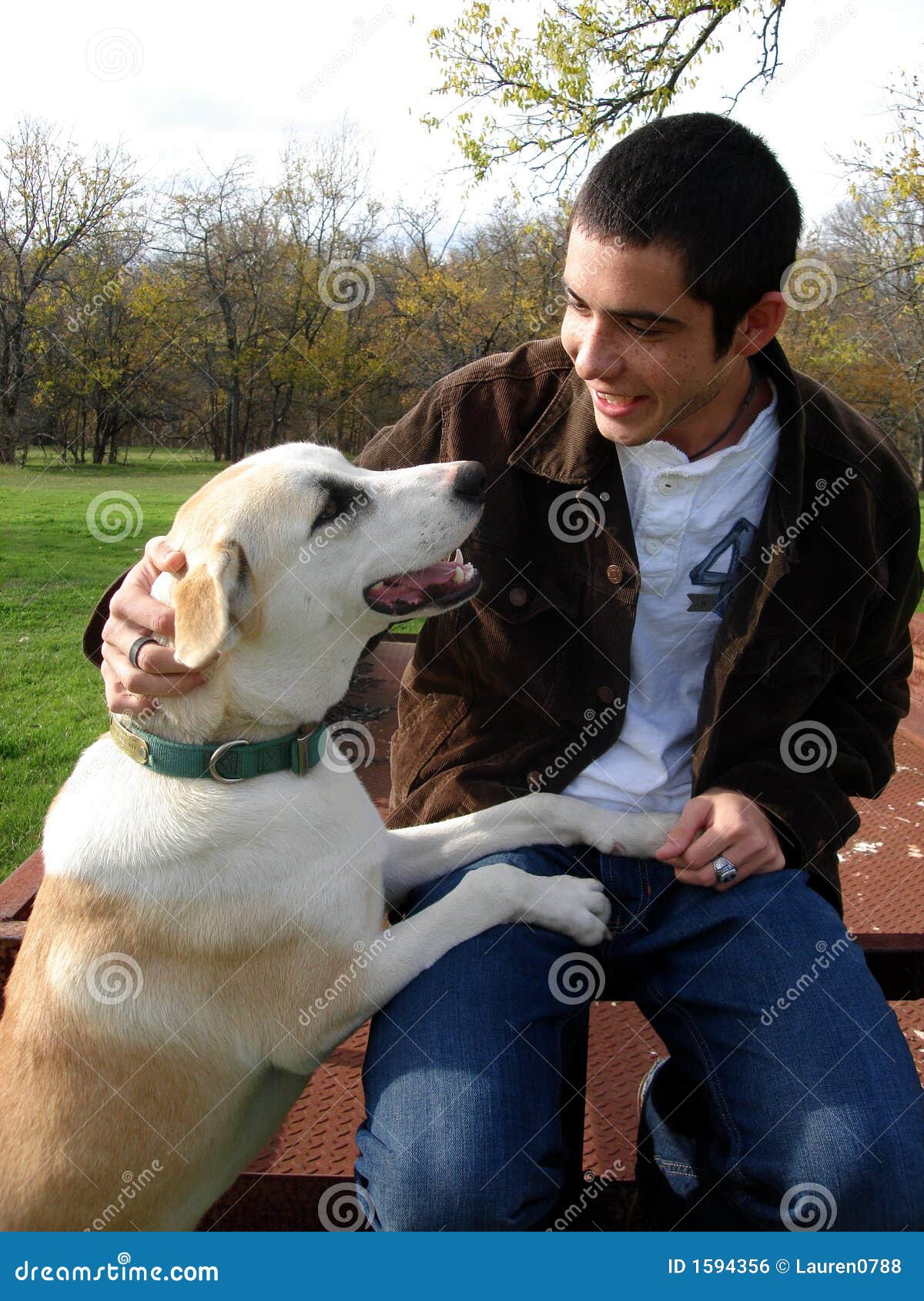 Young man and dog stock photo. Image of casual, furry - 1594356