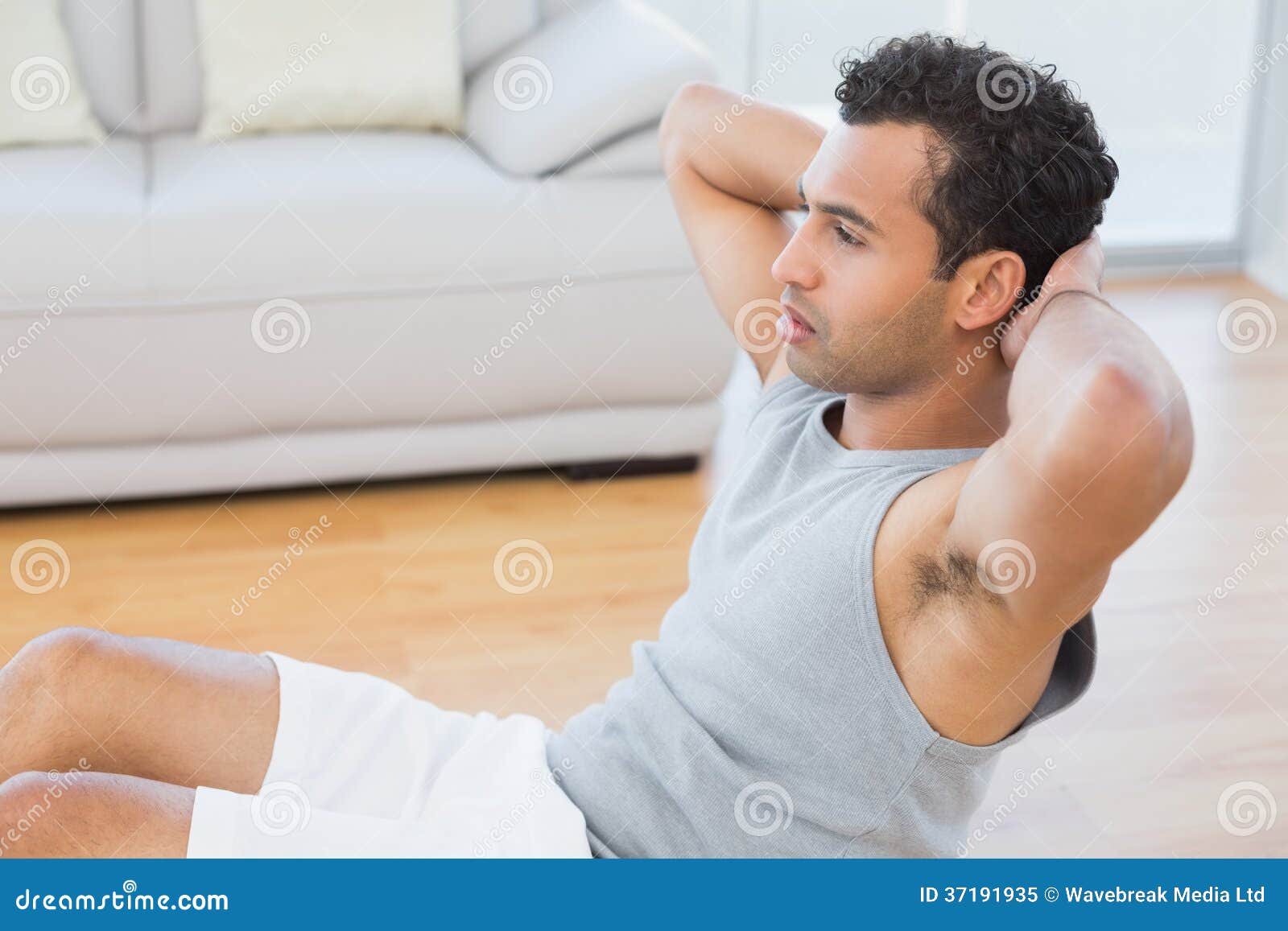 Young Man Doing Abdominal Crunches in the Living Room Stock Image ...