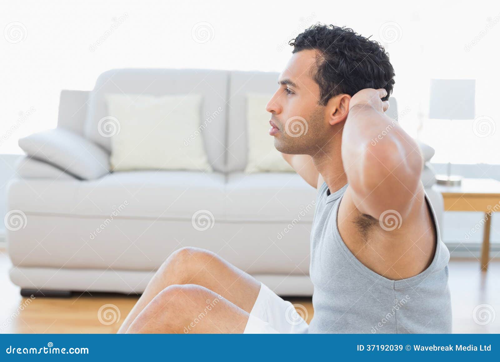 Young Man Doing Abdominal Crunches in the Living Room Stock Image ...