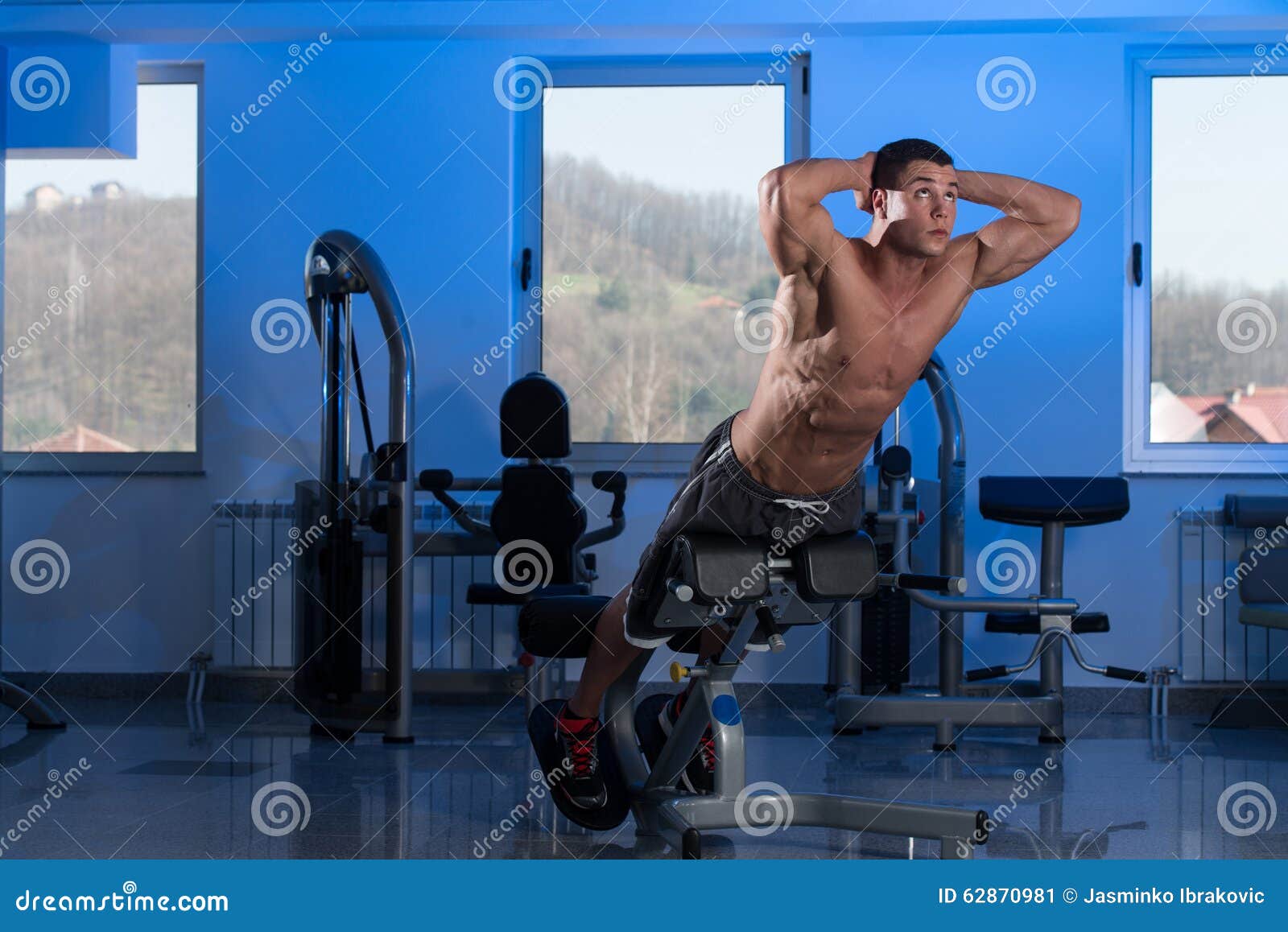 Young Man Doing Back Exercises in the Gym Stock Image - Image of ...