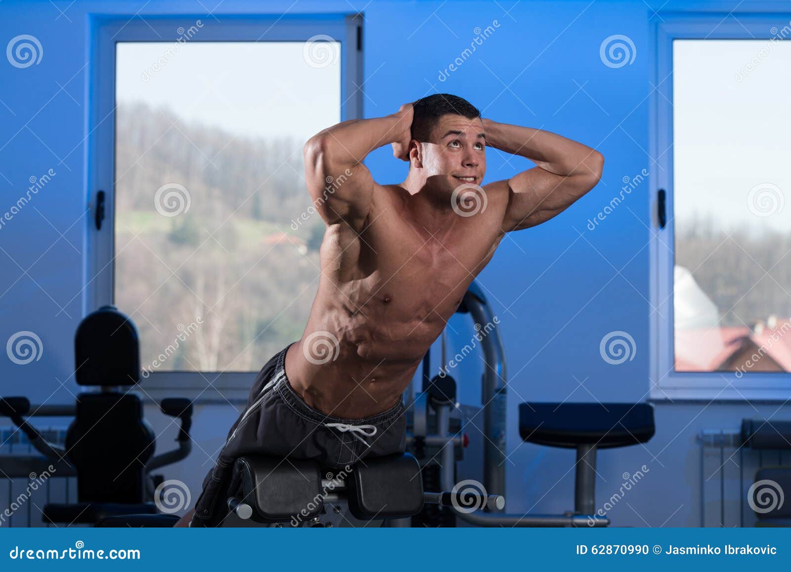 Young Man Doing Back Exercises in the Gym Stock Photo - Image of back ...
