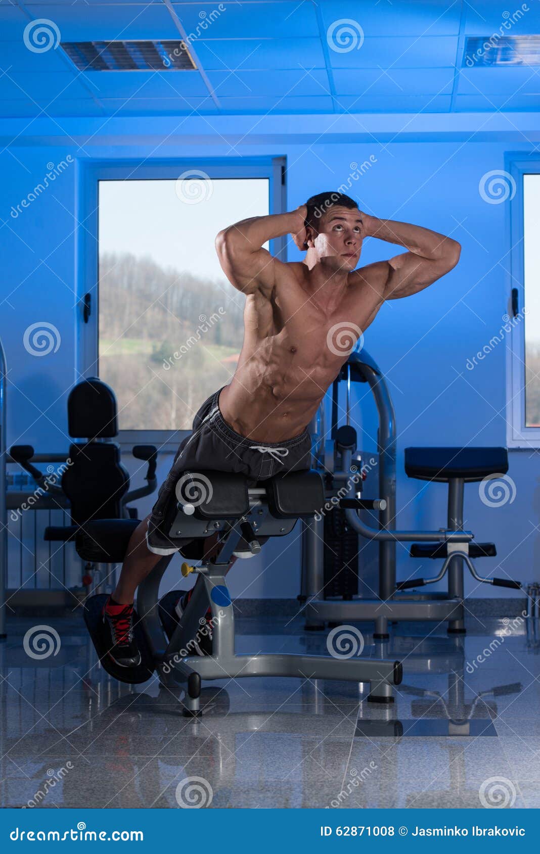 Young Man Doing Back Exercises in the Gym Stock Photo - Image of human ...