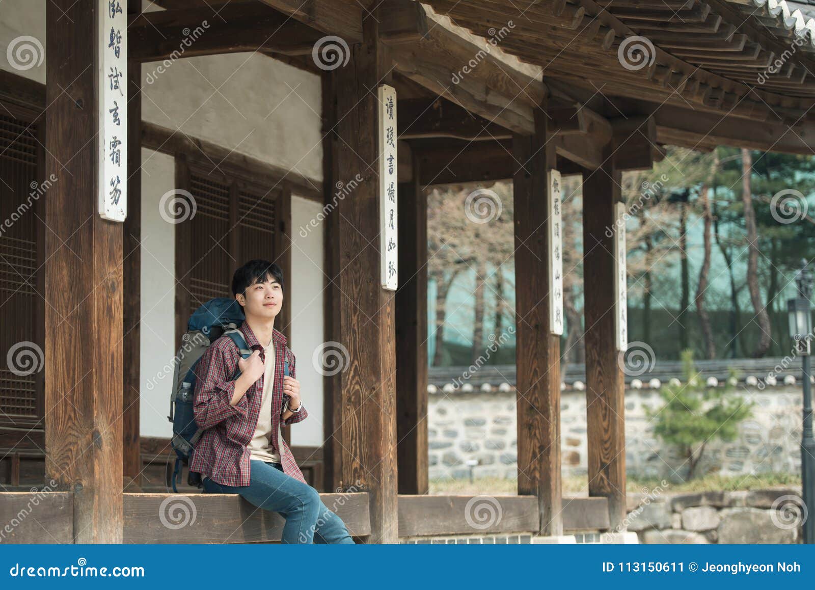 Young Man Doing a Backpacking Trip in a Korean Traditional House. Stock ...
