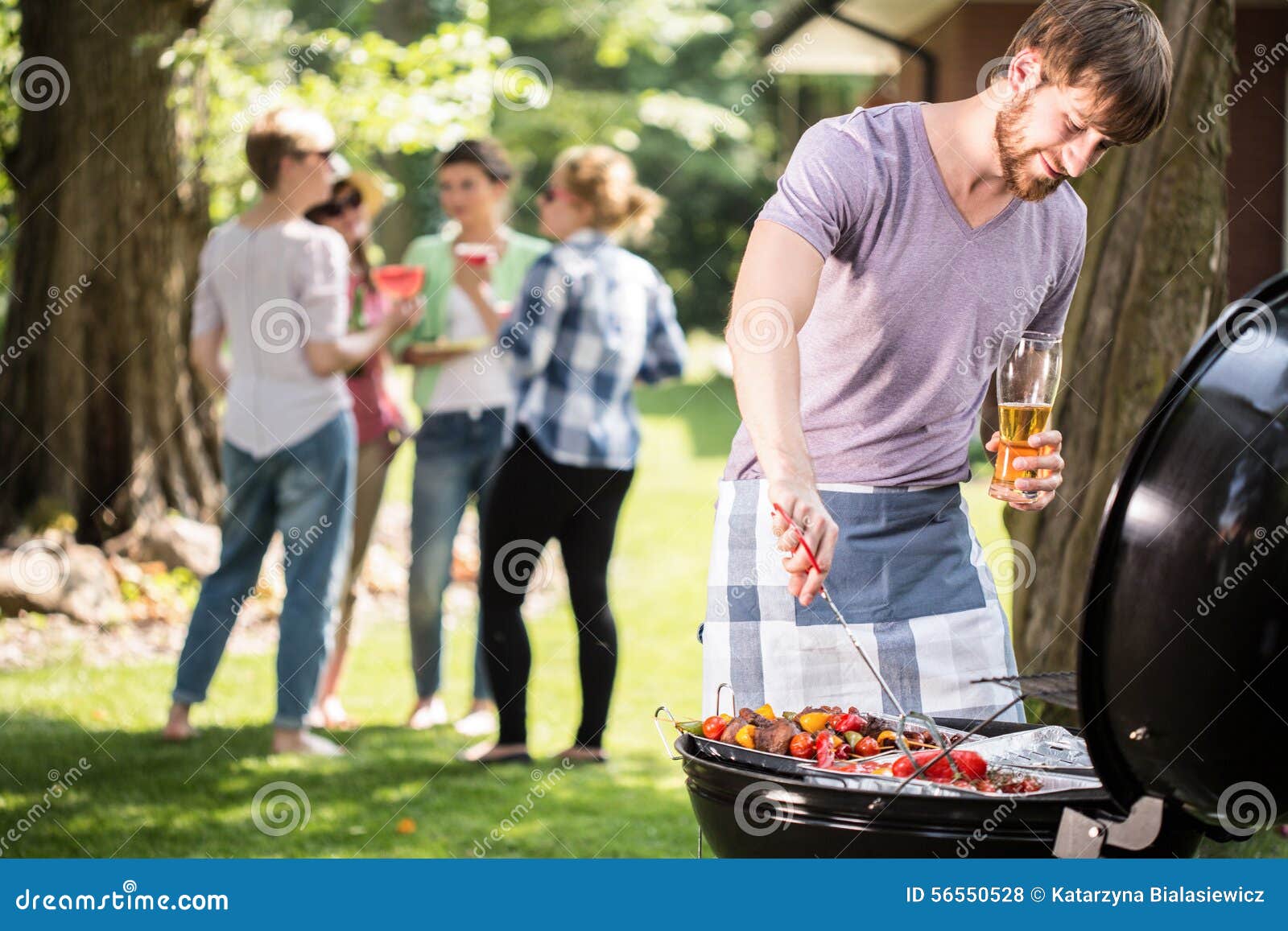 Young man doing barbecue stock photo. Image of host, leisure - 56550528