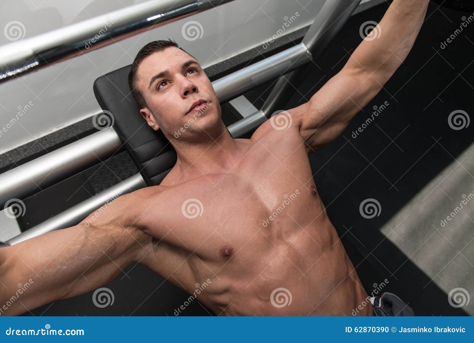 Young Man Doing Bench Press Exercise for Chest Stock Photo - Image of ...