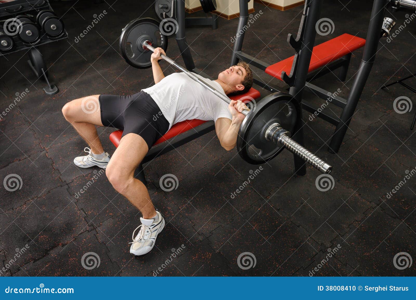 Young Man Doing Bench Press Workout in Gym Stock Photo - Image of ...