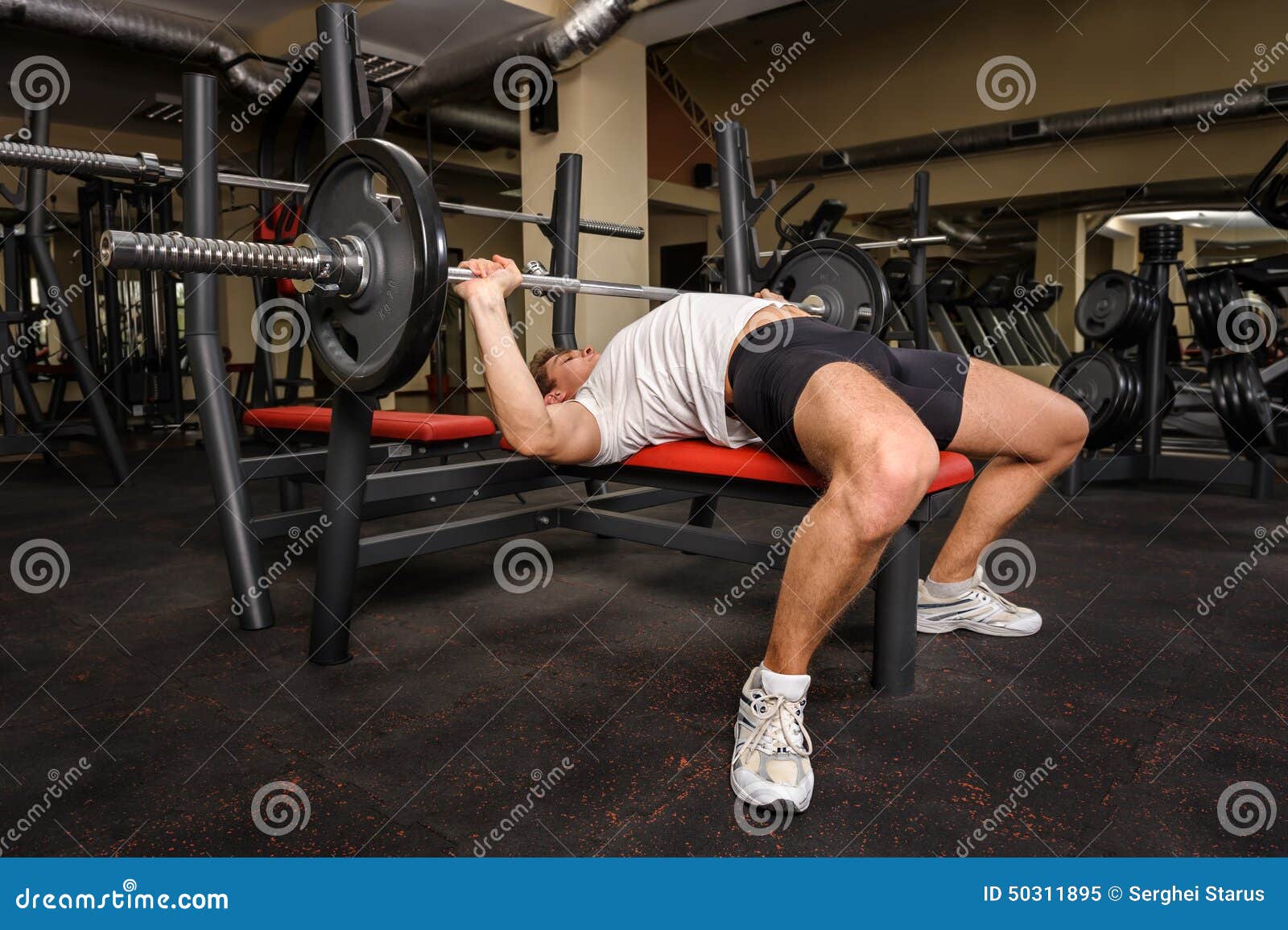 Young Man Doing Bench Press Workout in Gym Stock Image - Image of metal ...