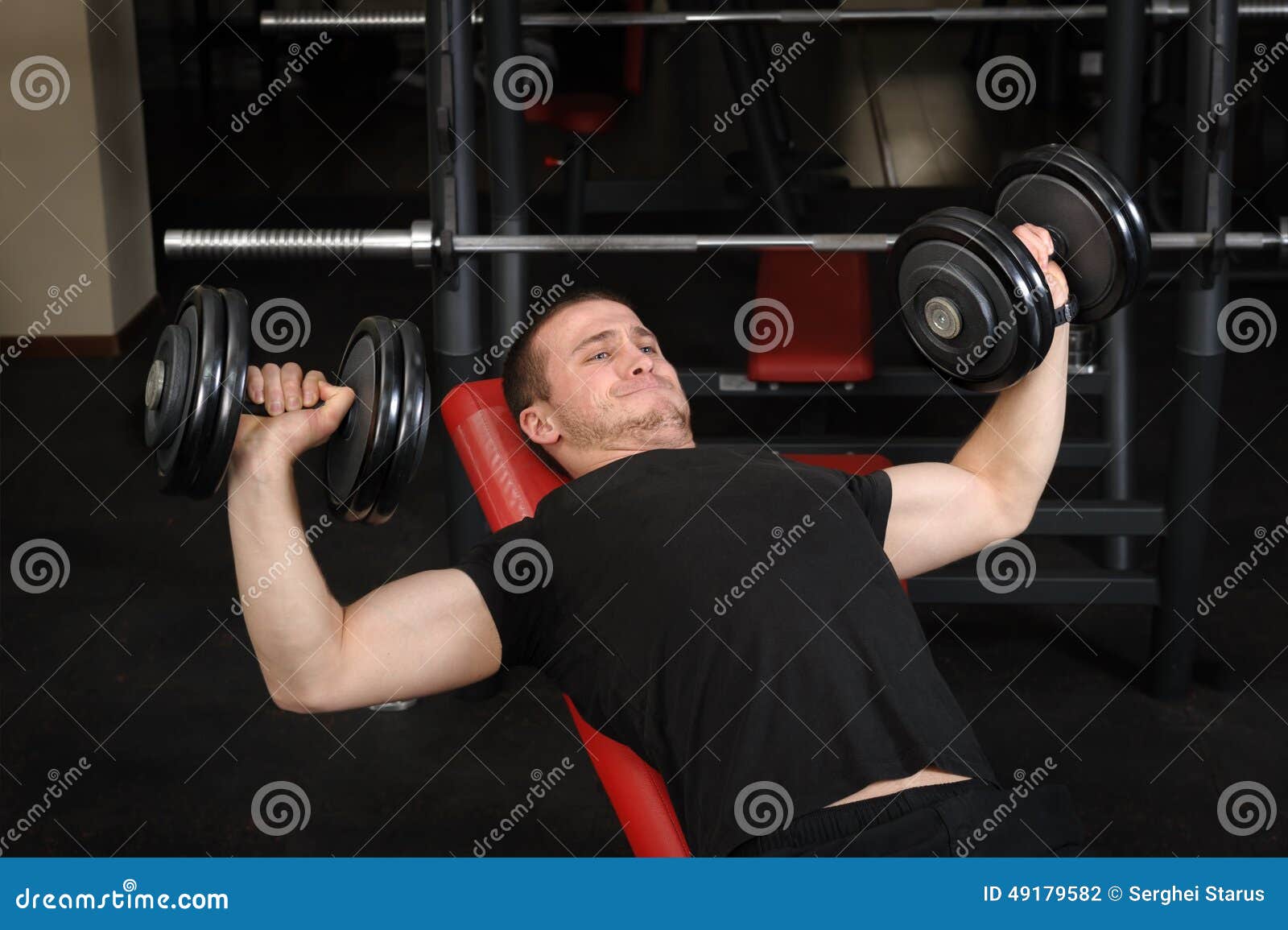 Young Man Doing Bench Press Workout in Gym Stock Photo - Image of ...