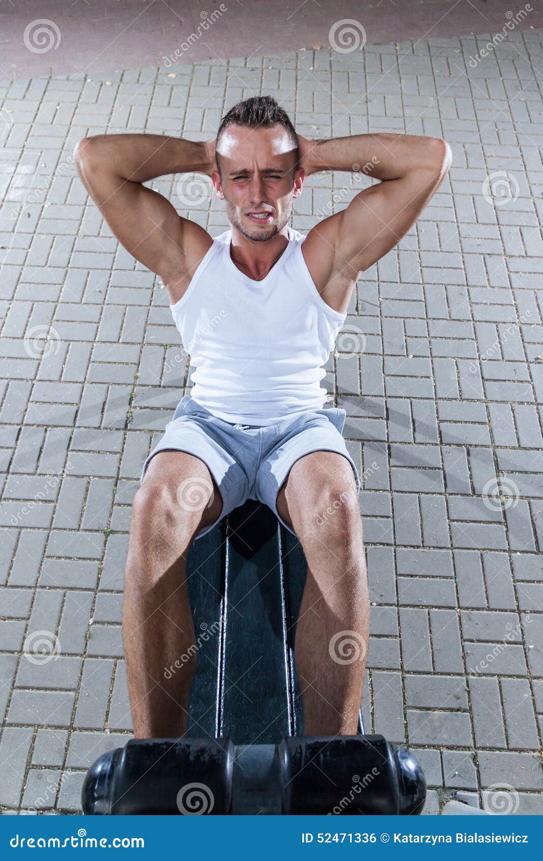 Young man doing crunches stock photo. Image of sporty - 52471336