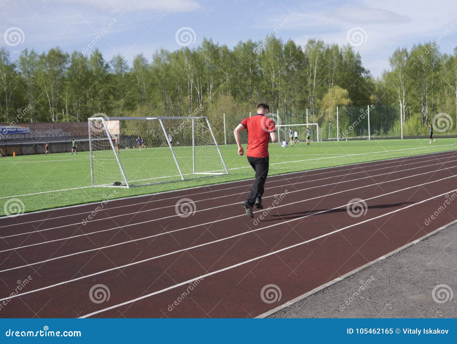 Young Man in Doing Exercise. at the Stadium Editorial Image - Image of ...