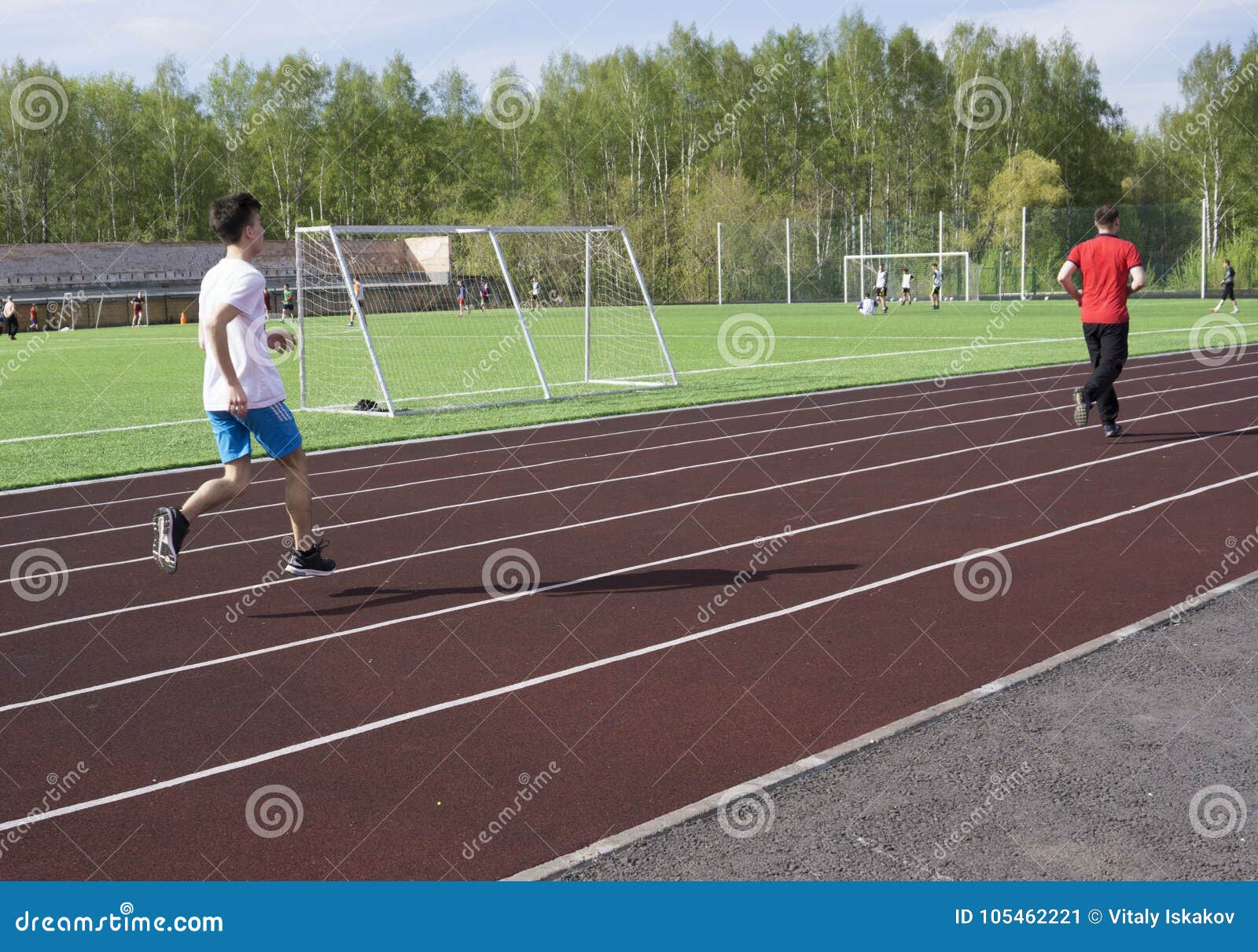 Young Man in Doing Exercise. at the Stadium Editorial Photo - Image of ...