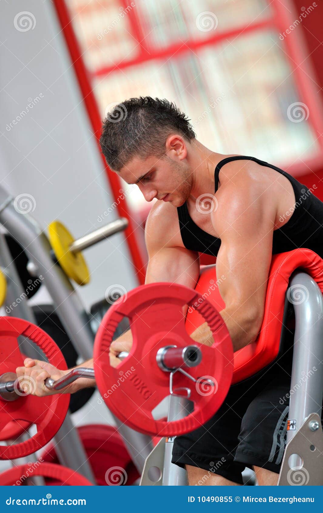 Young Man Doing Exercises in the Gym Stock Image - Image of fitness ...