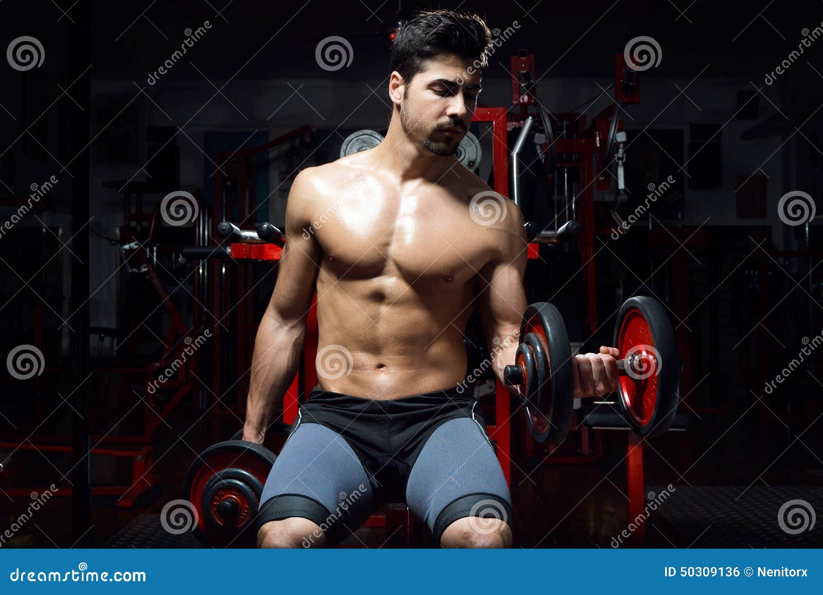 Young Man Doing Heavy Weight Exercise in Gym. Stock Photo - Image of ...