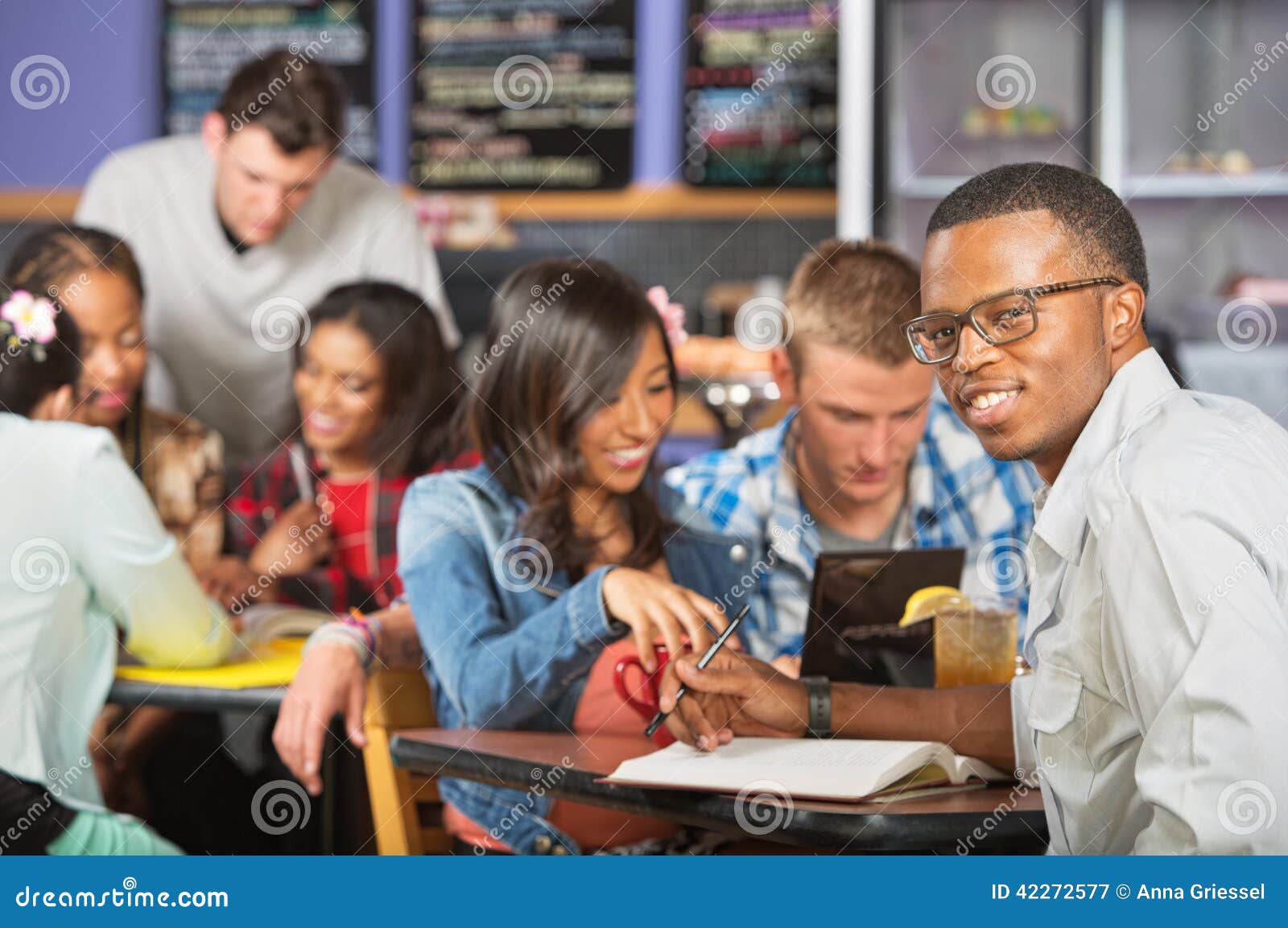Young Man Doing Homework stock image. Image of asian - 42272577