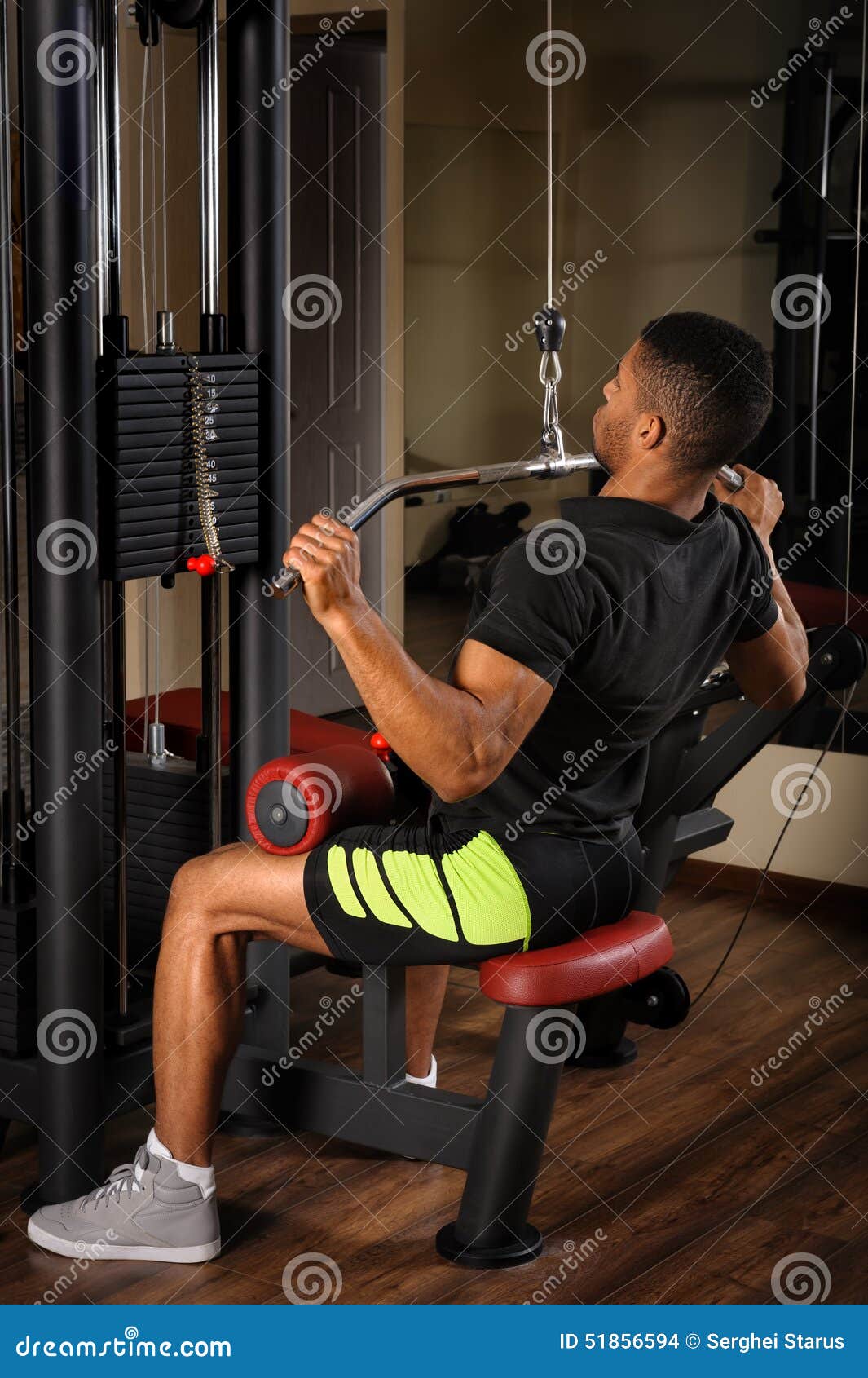 Young Man Doing Lats Pull-down Workout Stock Photo - Image of interior ...