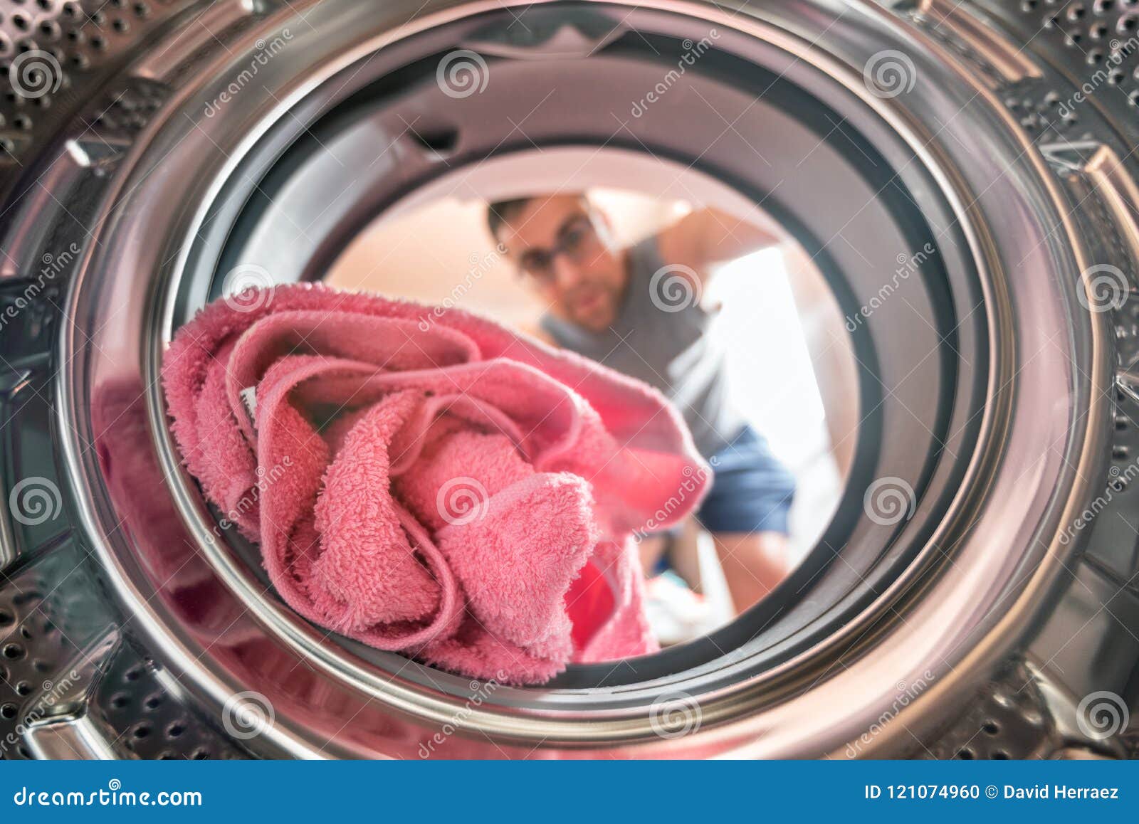 Young Man Doing Laundry View from the Inside of Washing Machine Stock ...