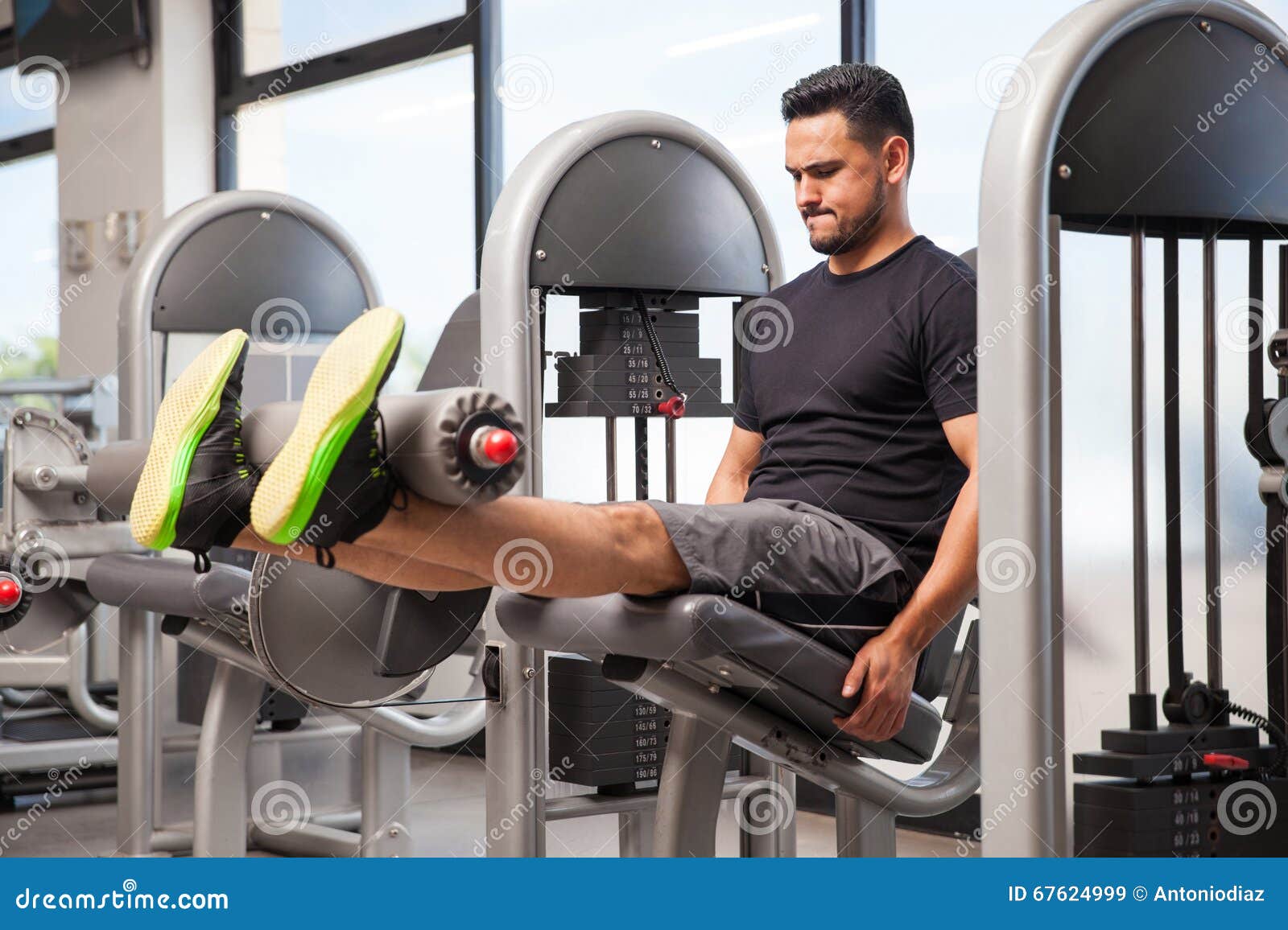 Young Man Doing Leg Extensions Stock Image - Image of good, fitness ...