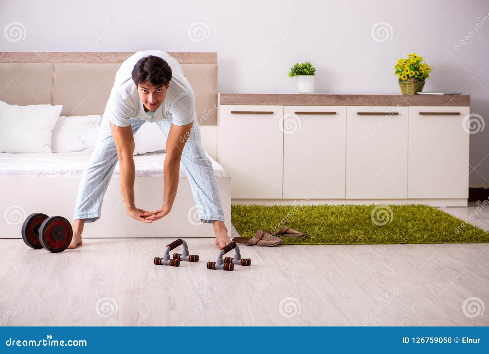 The Young Man Doing Morning Routine in Bedroom Stock Photo - Image of ...