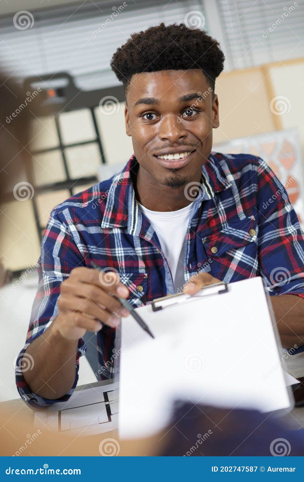 Young Man Doing Paperwork at Office Desk Stock Image - Image of adult ...