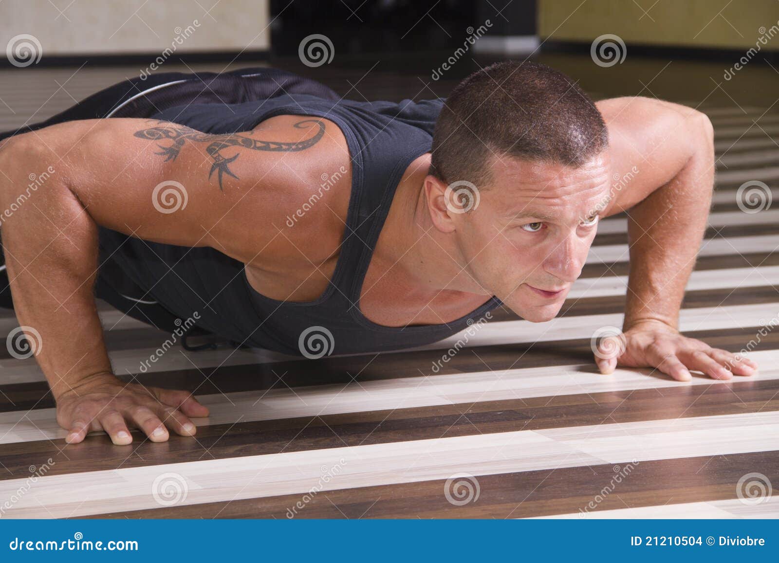 Young man doing pushups stock photo. Image of muscular - 21210504