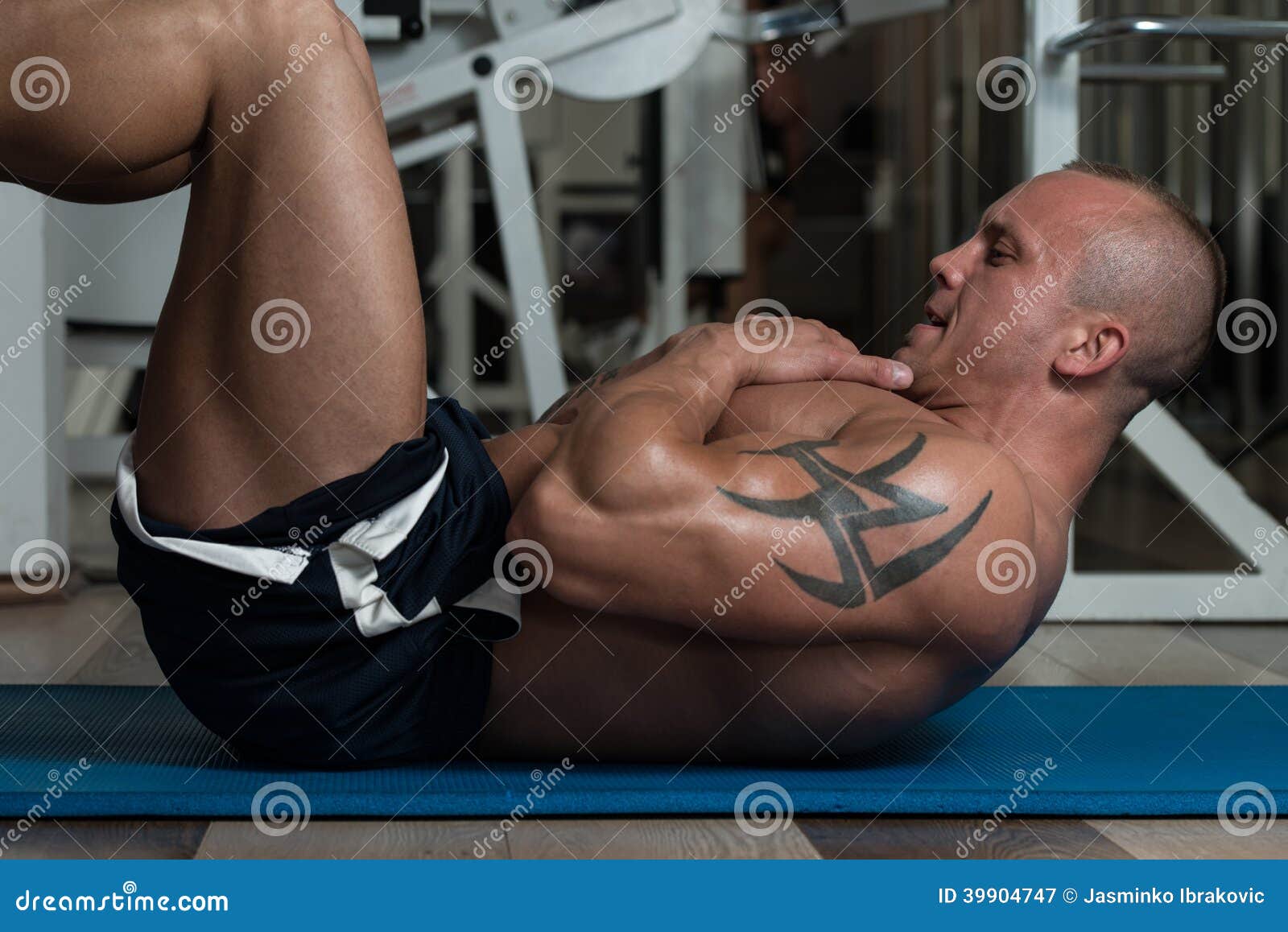 Young Man Doing Sit-Ups on Exercise Mat Stock Image - Image of strong ...