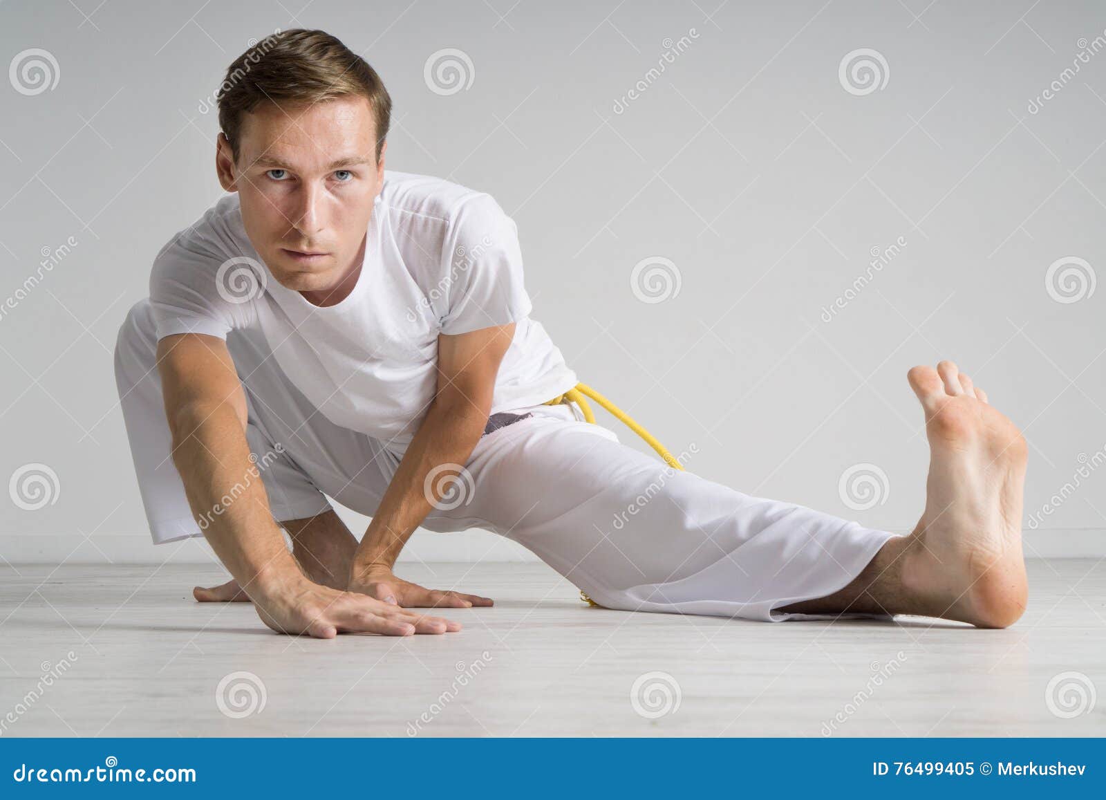 Young Man Doing Stretching Exercises Stock Image - Image of male ...