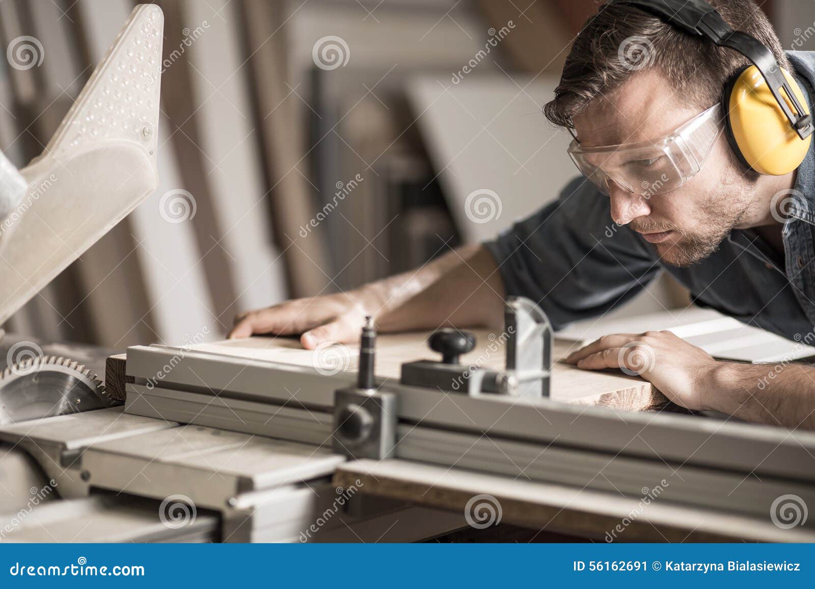 Young man doing woodwork stock image. Image of measurement - 56162691