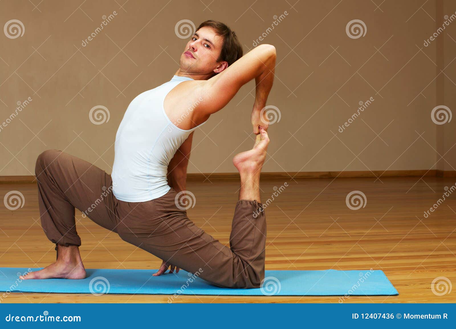 Young man doing yoga stock photo. Image of caucasian - 12407436