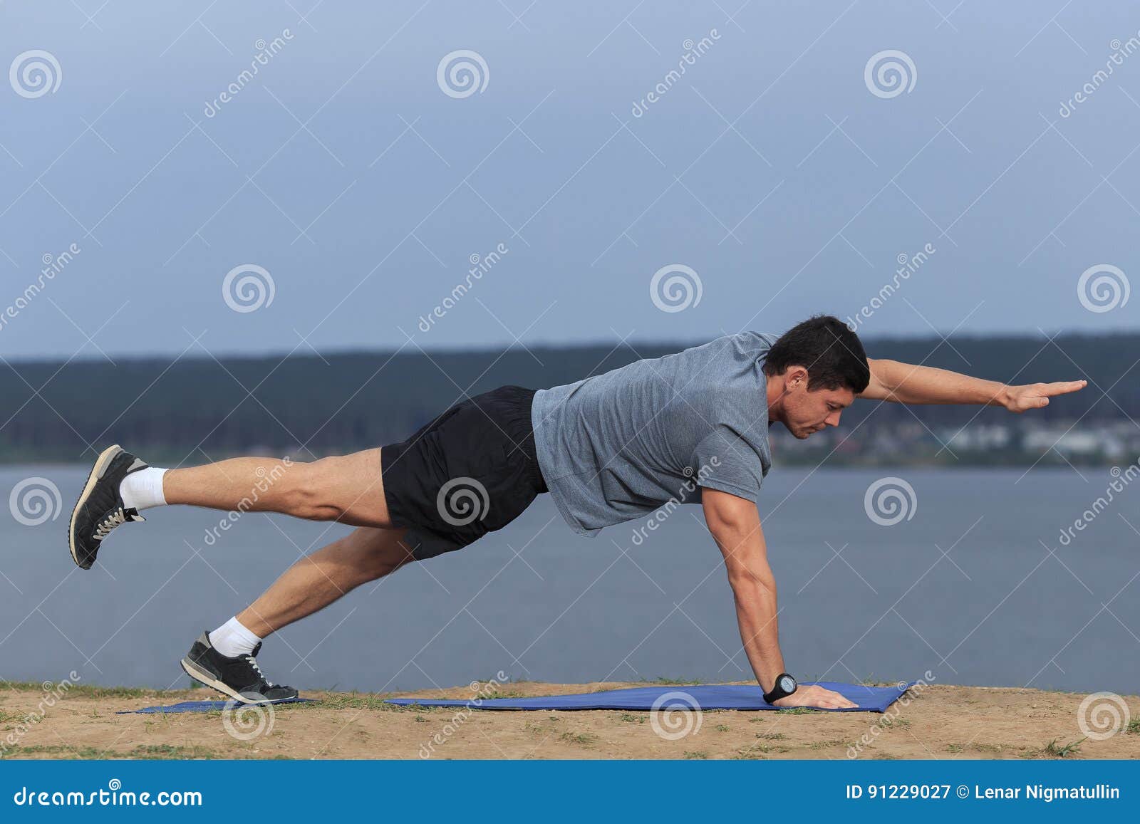 Young Man Doing Yoga Outside in Natural Environment Stock Image - Image ...