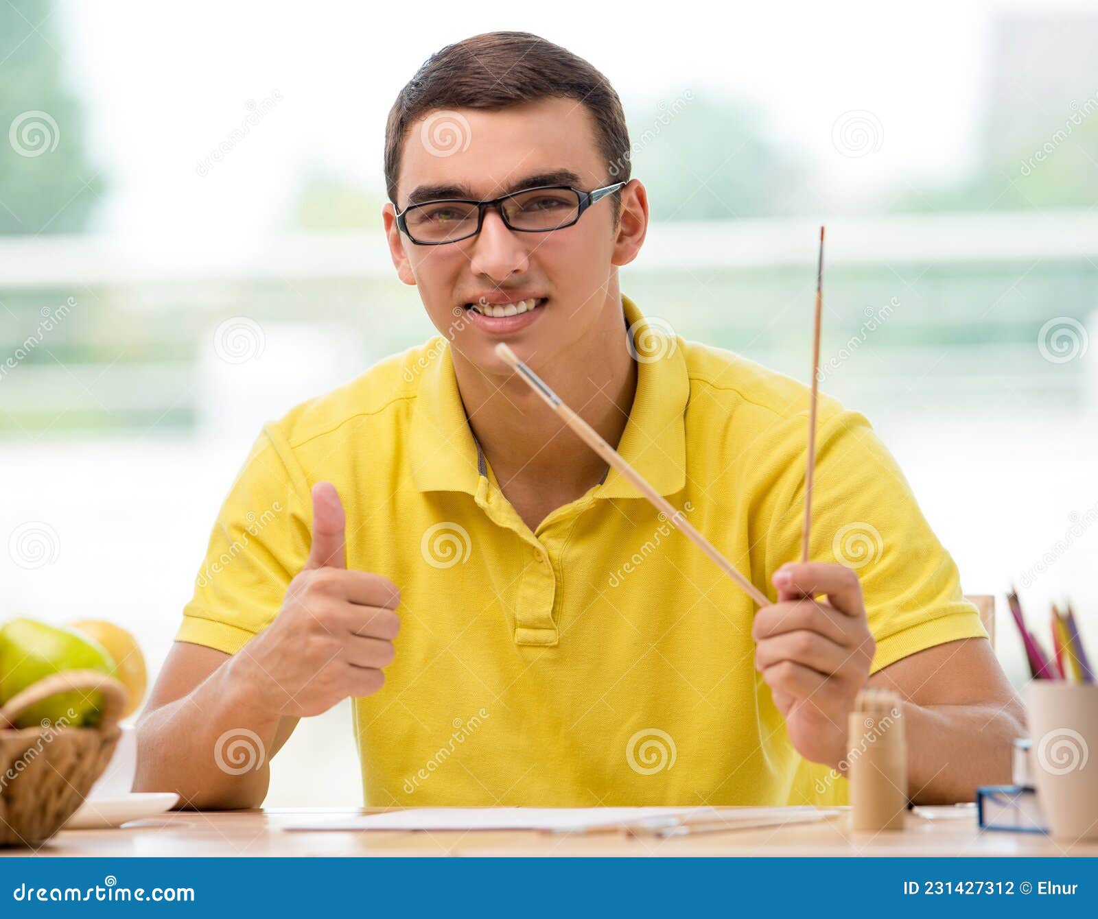 Young Man Drawing Pictures in Studio Stock Photo - Image of student ...