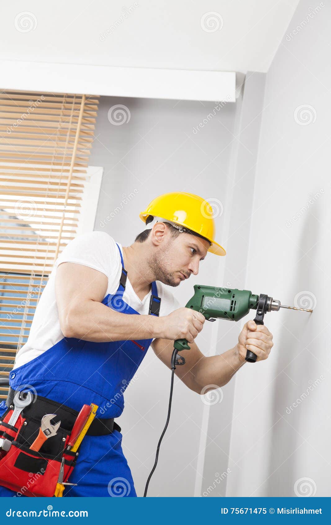Young Man Drilling Hole in Wall Stock Image - Image of male ...