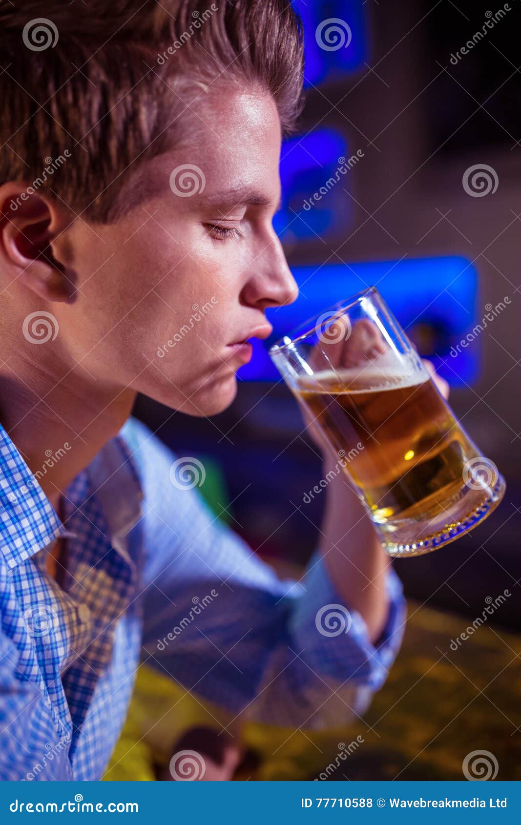Young man drinking beer stock photo. Image of food, disco - 77710588