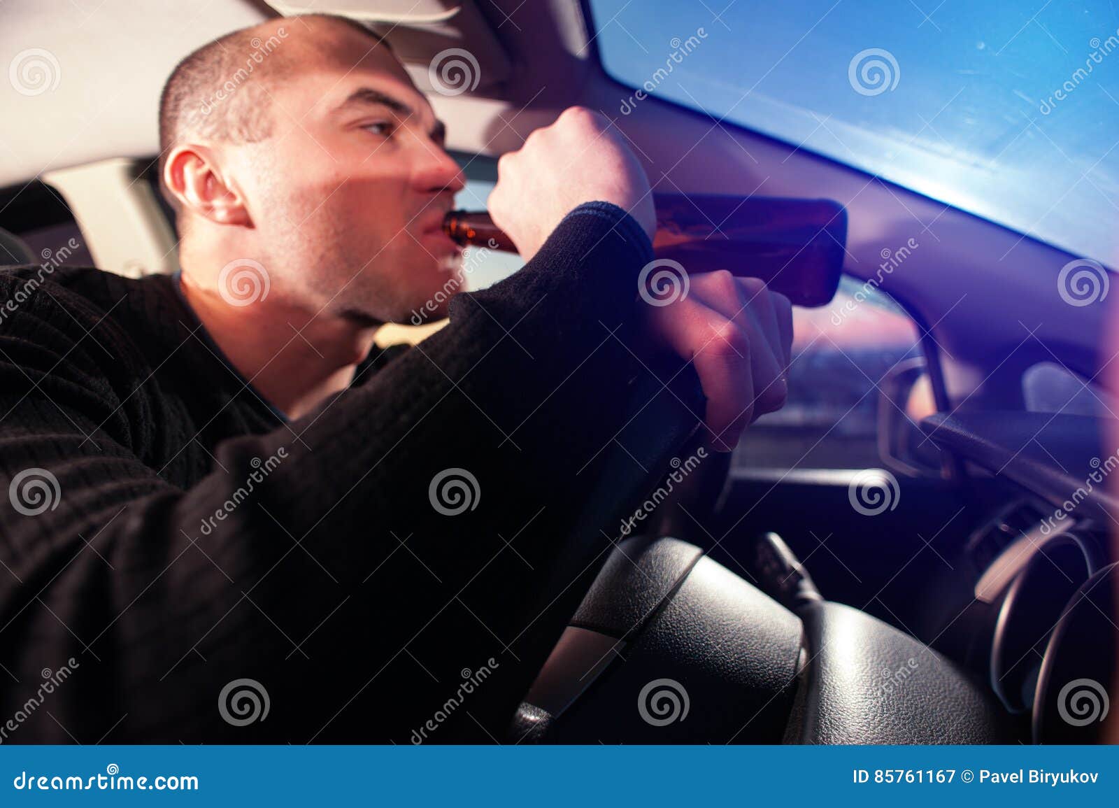 Young Man Drinking Beer while Driving a Car Stock Image - Image of ...