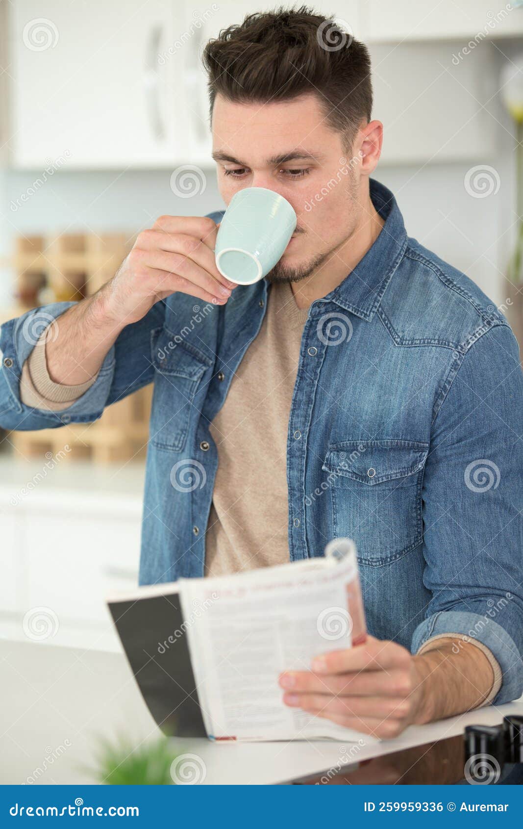 Young Man Drinking Coffee and Reading Book Stock Photo - Image of ...