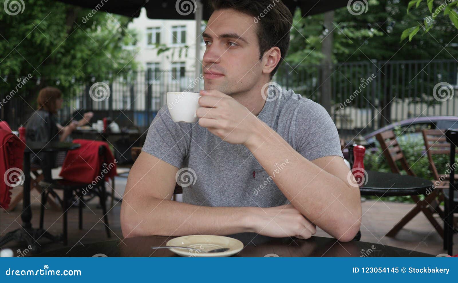 Young Man Drinking Coffee while Sitting in Cafe Terrace Stock Image ... Young Man Drinking Coffee while Sitting in Cafe Terrace Stock Image ...