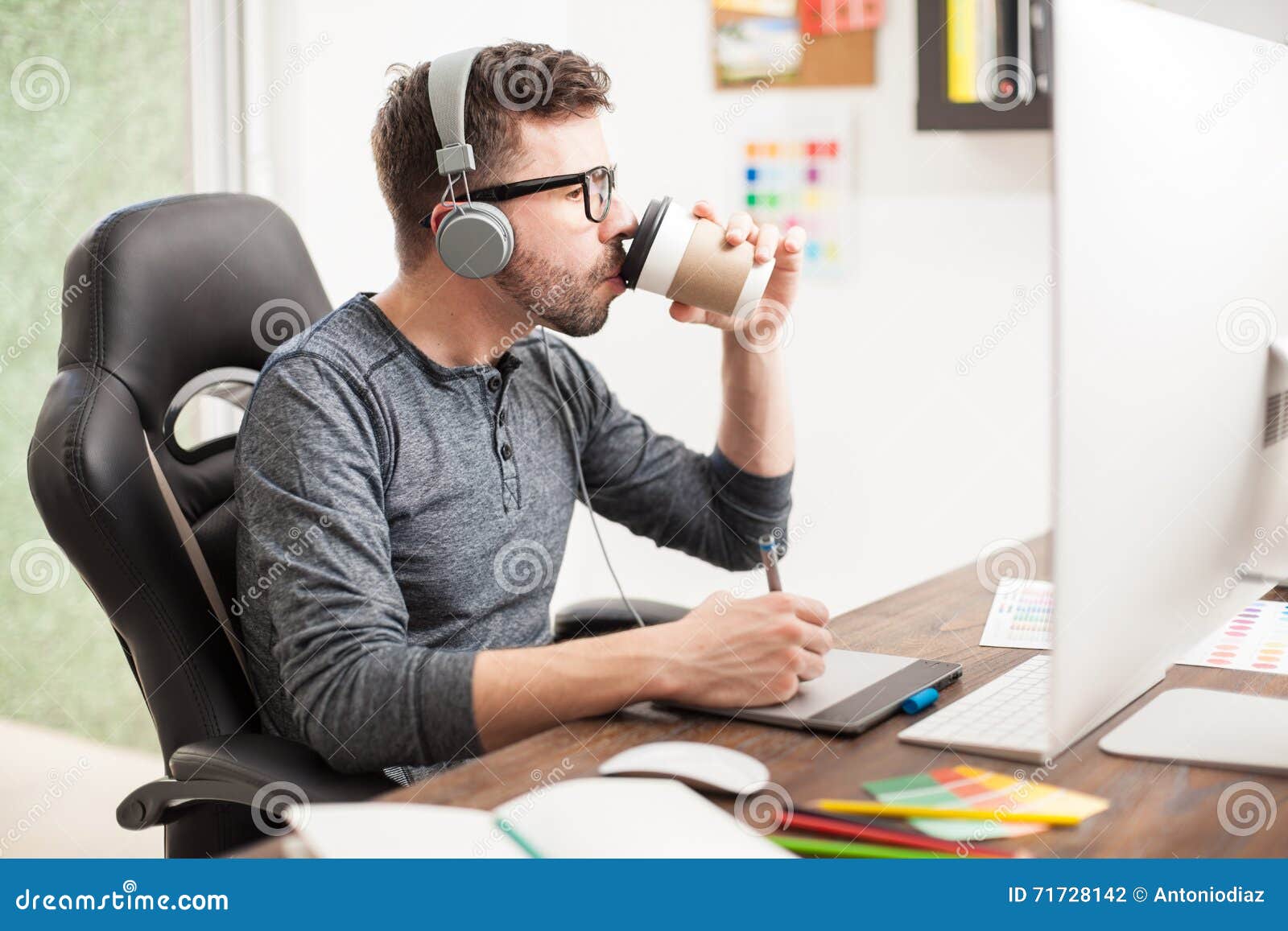 Young Man Drinking Coffee at Work Stock Photo - Image of nerdy, graphic ...
