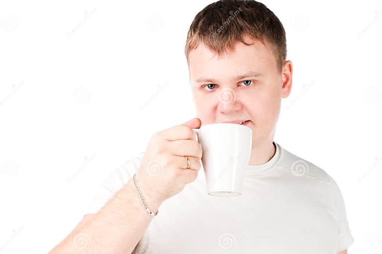 Young man drinking a cup stock photo. Image of saucer - 21870832