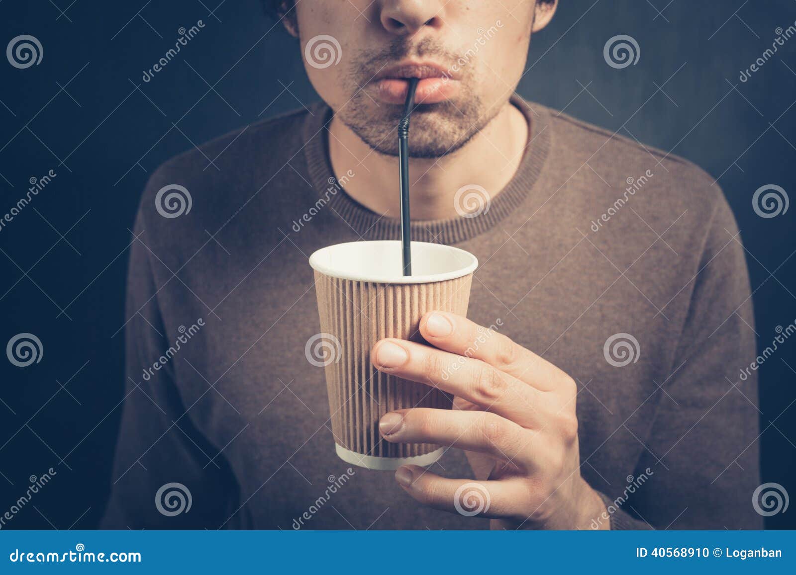 Young Man Drinking from Paper Cup with Straw Stock Photo - Image of ...