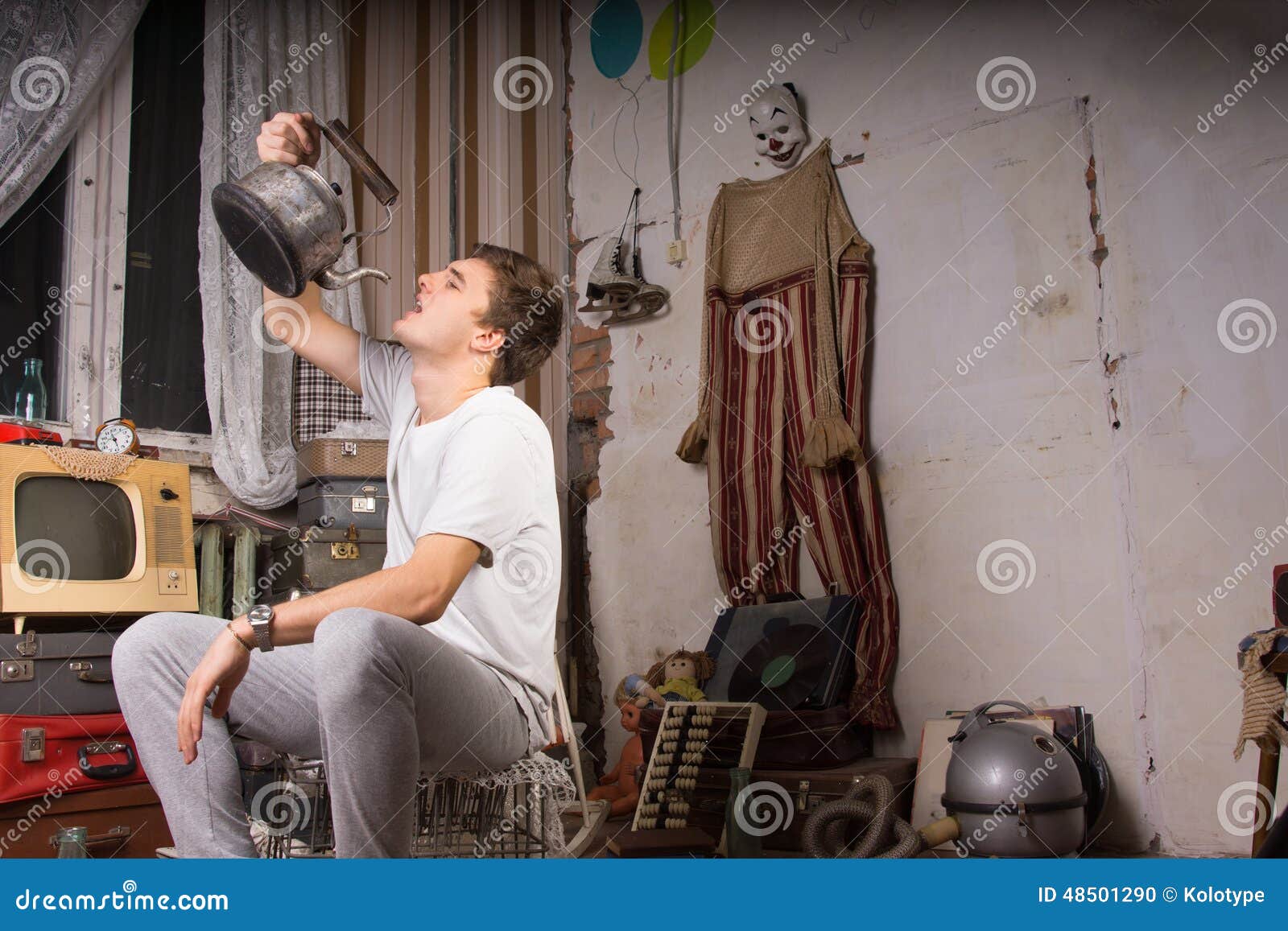 Young Man Drinking Something from Old Kettle Stock Photo - Image of ...