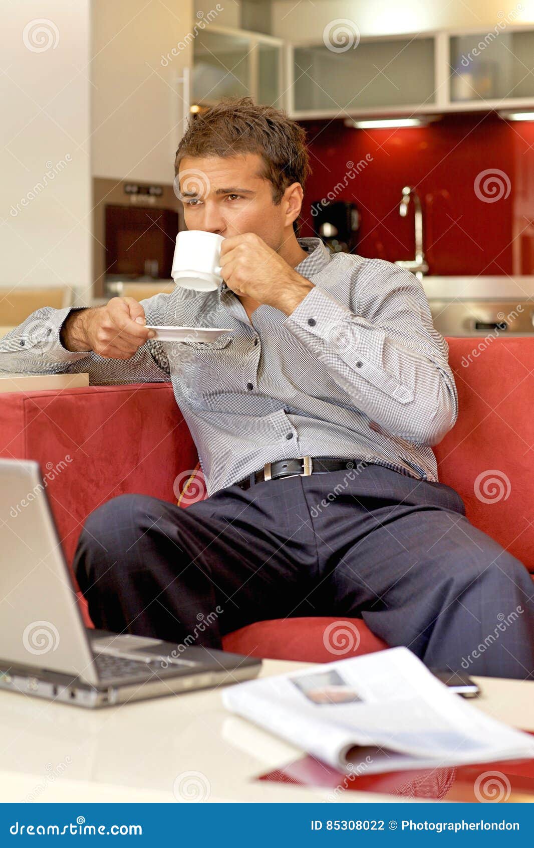 Young Man Drinking Tea, Sitting in Sofa Stock Photo - Image of ...
