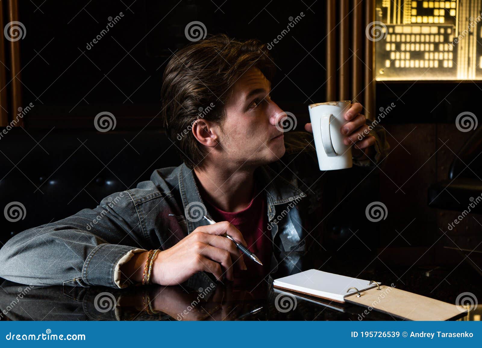 A Young Man is Drinking Tea at the Table Stock Image - Image of ...