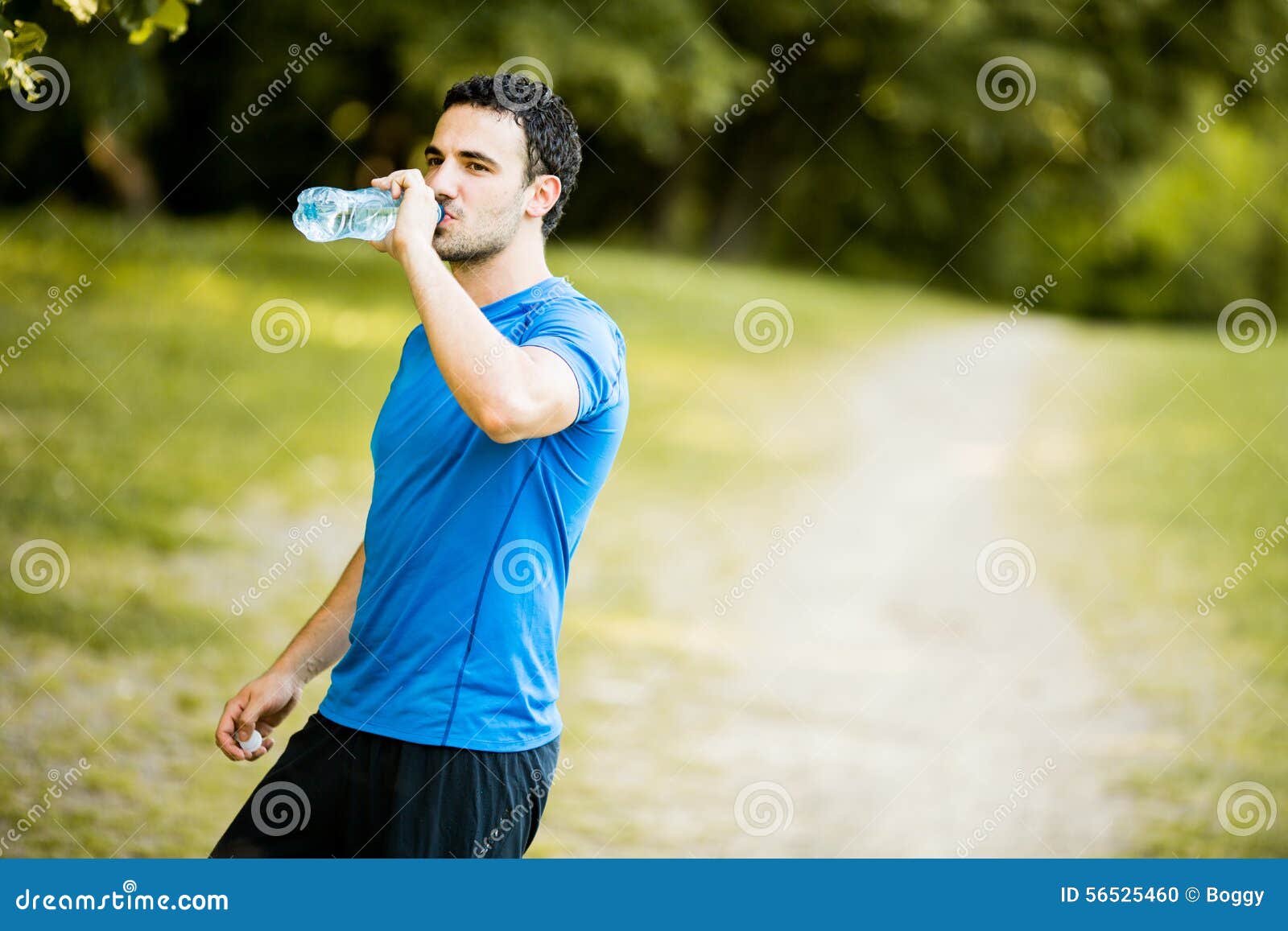 Young man drinking water stock photo. Image of water - 56525460