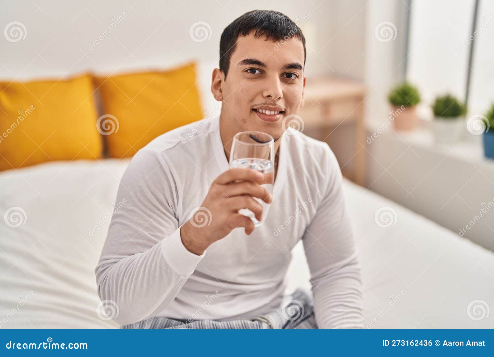 Young Man Drinking Water Sitting on Bed at Bedroom Stock Photo - Image ...